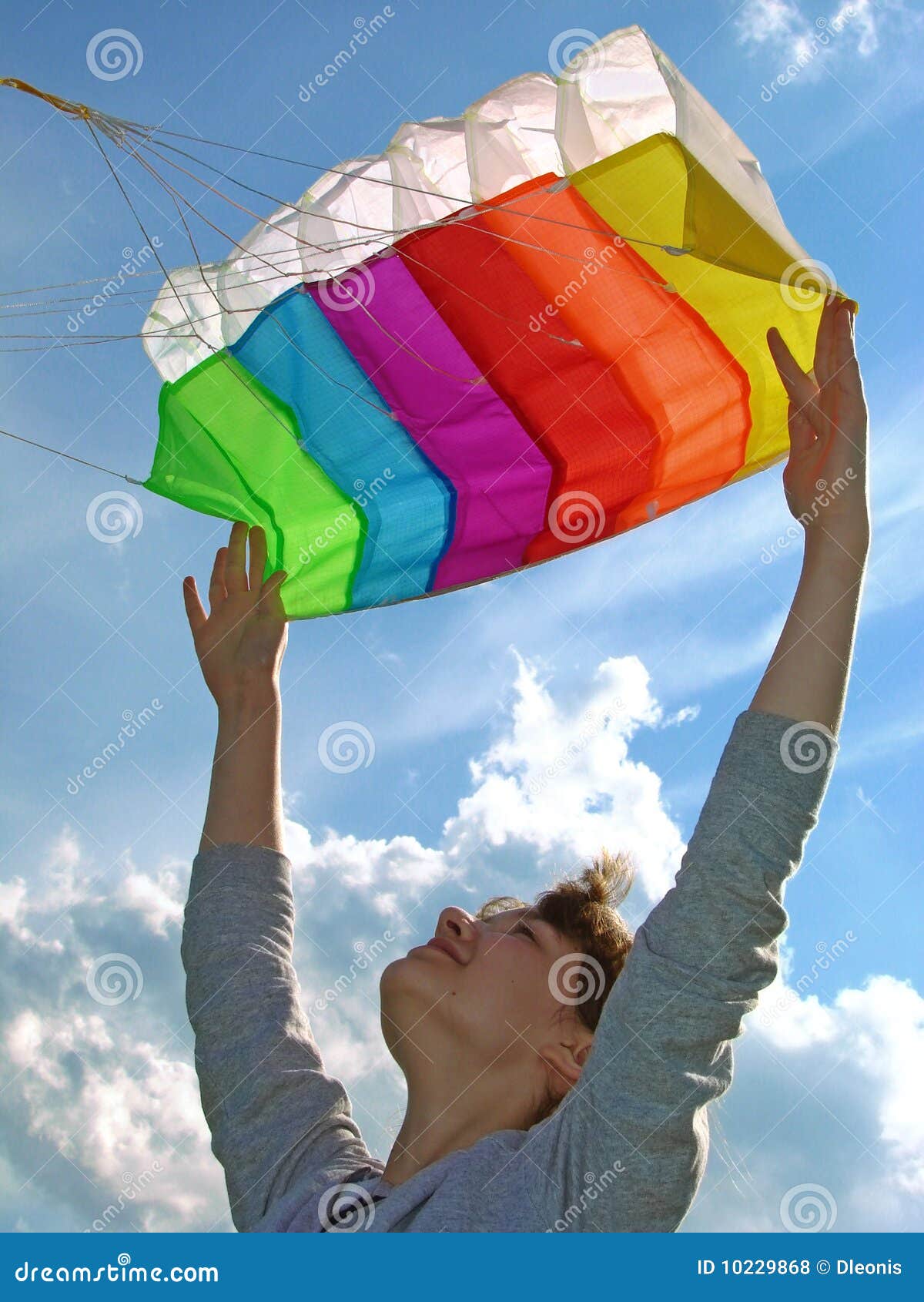 Flying A Kite. The Boy Runs Across The Field With A Kite. Bright ...