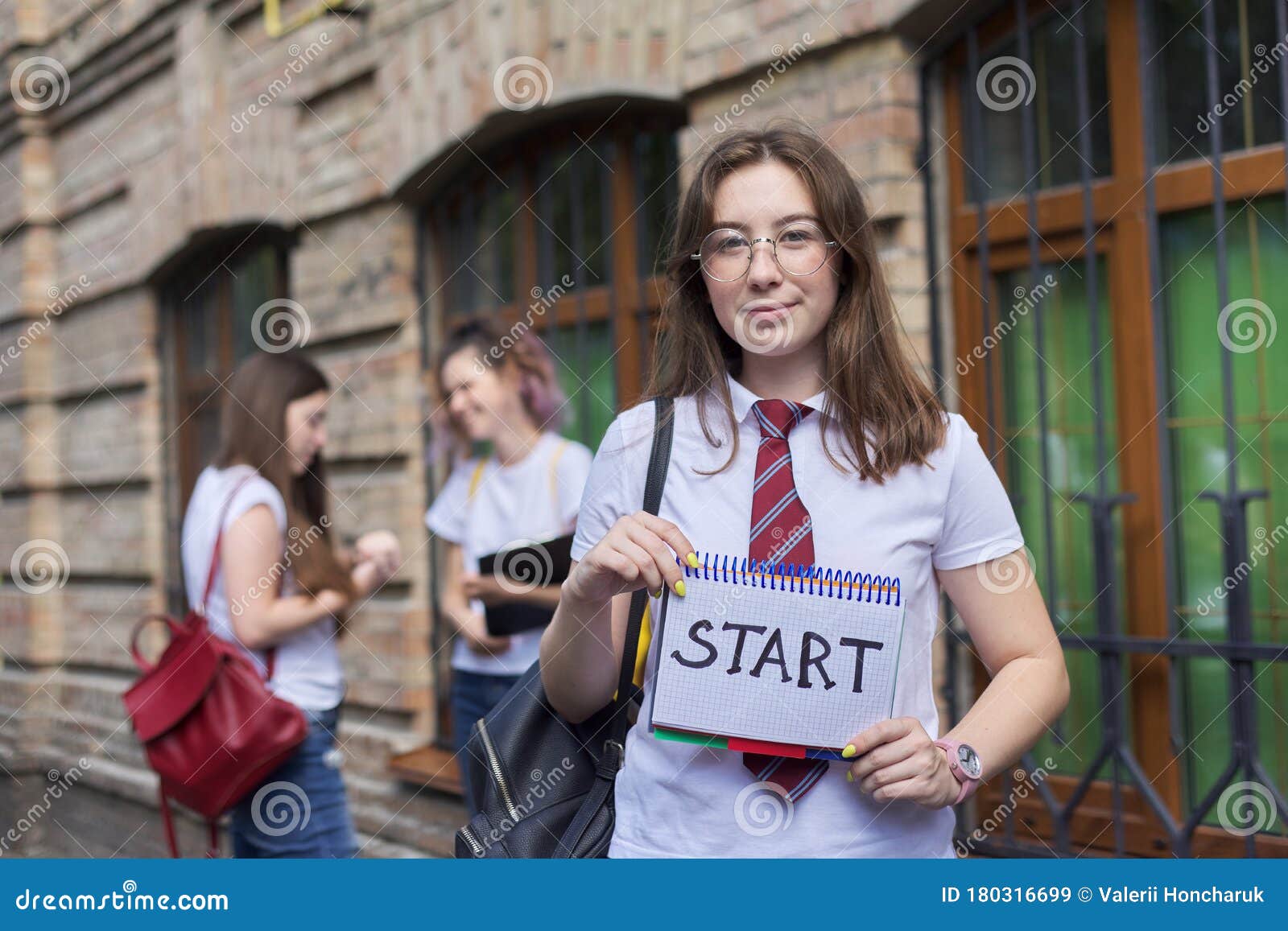 Start. Girl Student Holds Notebook with Word Start Stock Image - Image ...