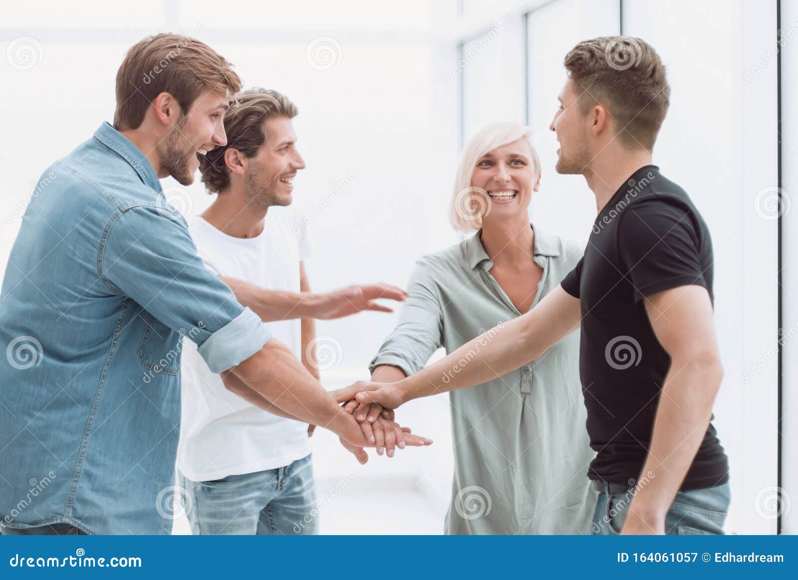 Start-up. Smiling Co-workers Putting Their Hands Together. Stock Image ...