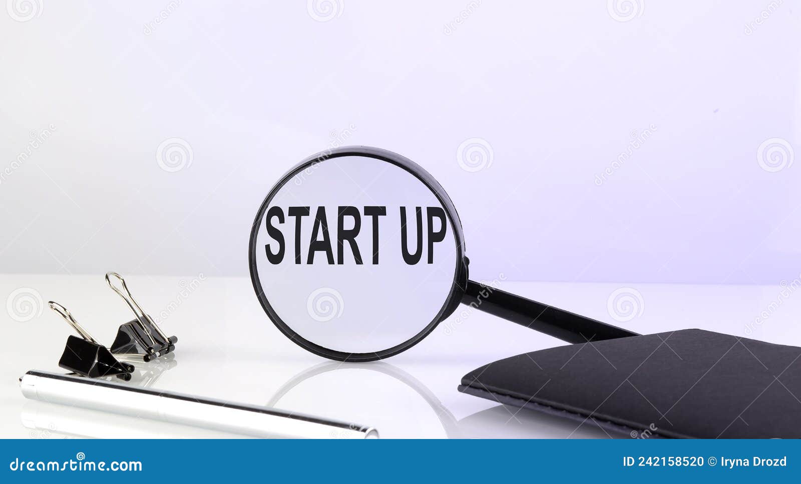 START UP Text Concept. Magnifier Glass with Text with Notebook and Pen ...