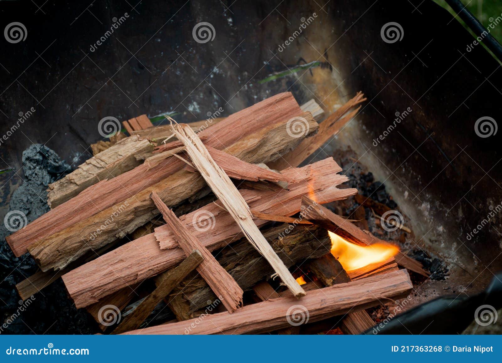 Starting the Campfire in a Firepit with Kindling Stock Photo - Image of ...