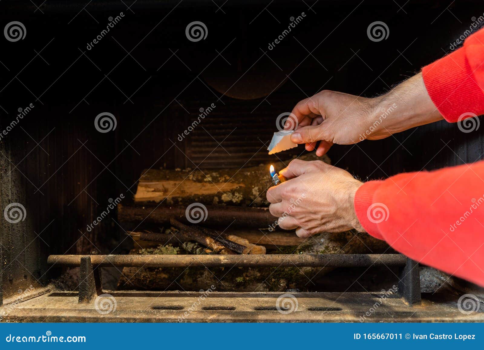 Starting Up a Fire Inside a Chimney with Lighter Cubes Stock Image ...