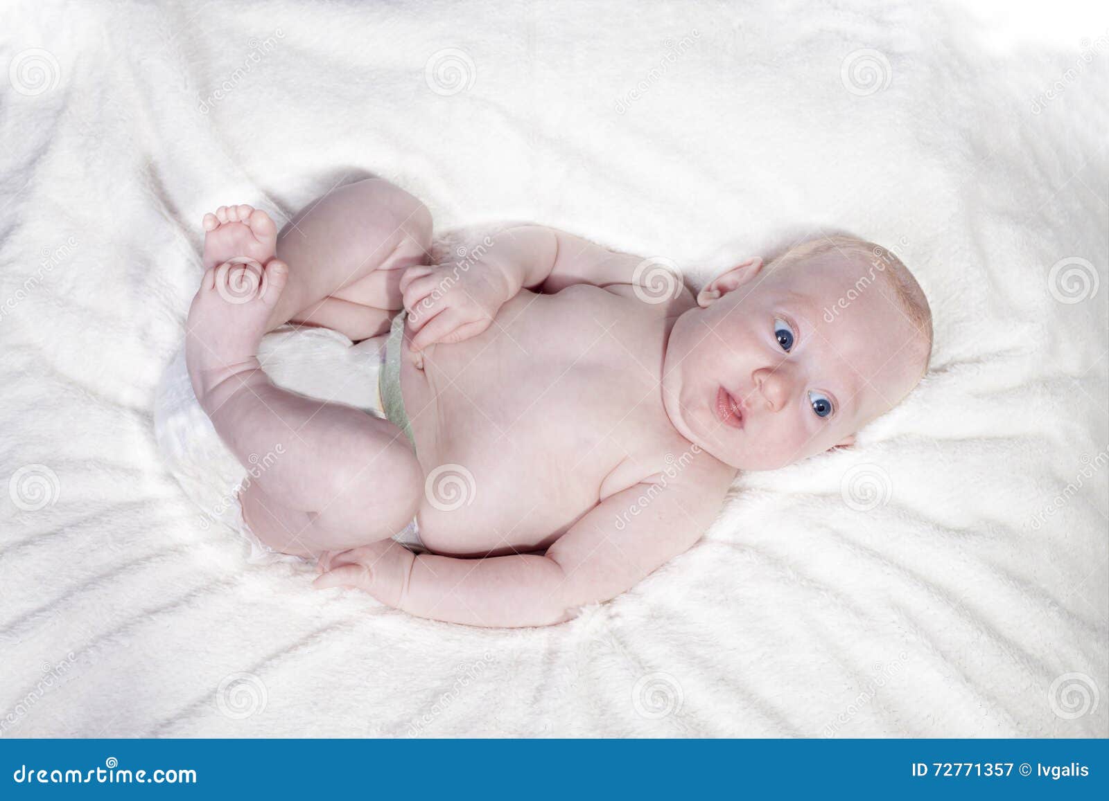 Startled baby on a blanket stock image. Image of portrait - 72771357