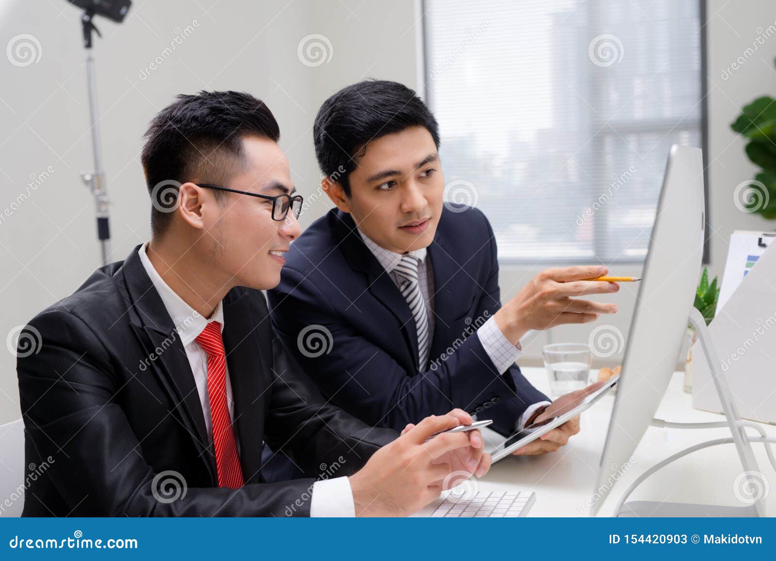 Startup Business Partners Working Together in Desktop Stock Image ...