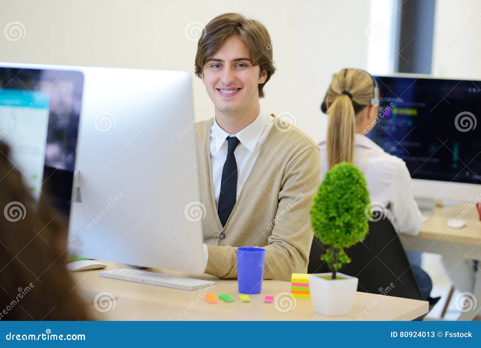 Startup Business, Software Developer with Braces Working on Computer at ...