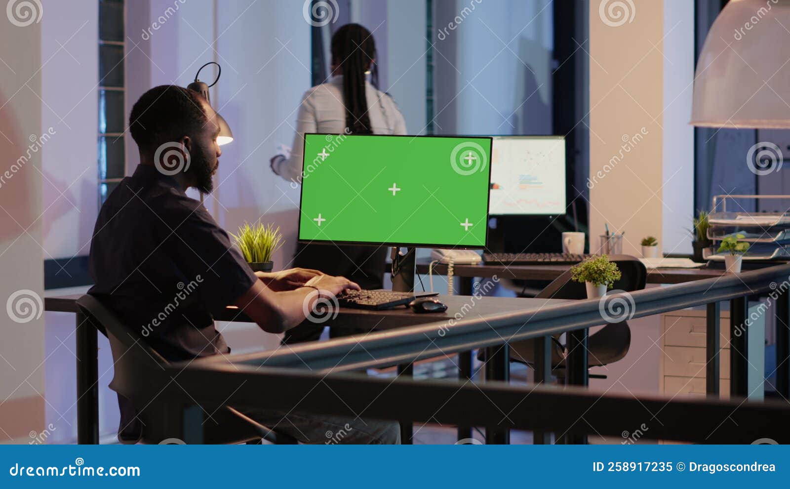 Startup Worker Analyzing Greenscreen on Monitor in Office with Big ...