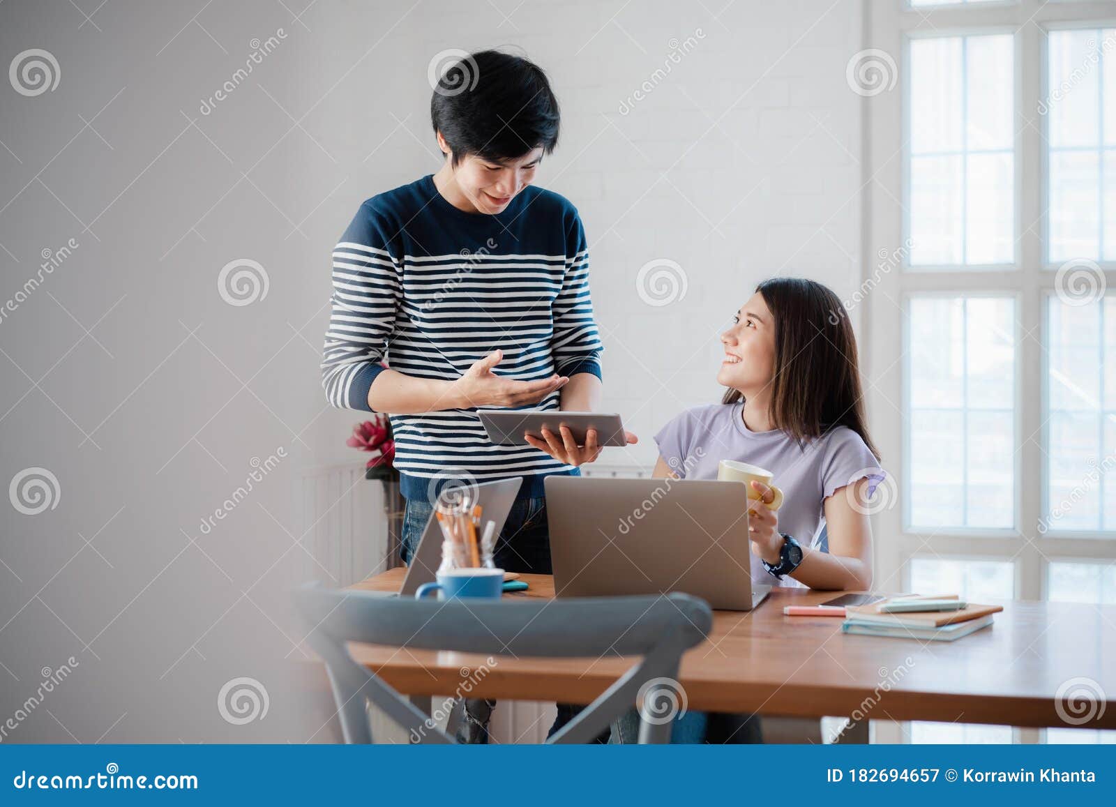 Startup Young Asian Caucasian Colleagues Discussing Work Together On
