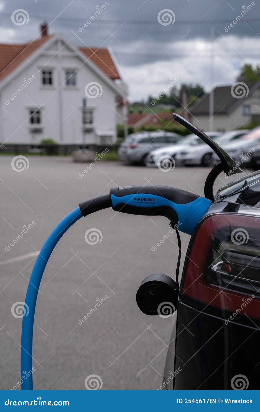 A Static Shot of a Solid Black Tesla Model 3 Dual Motor Charging at the ...