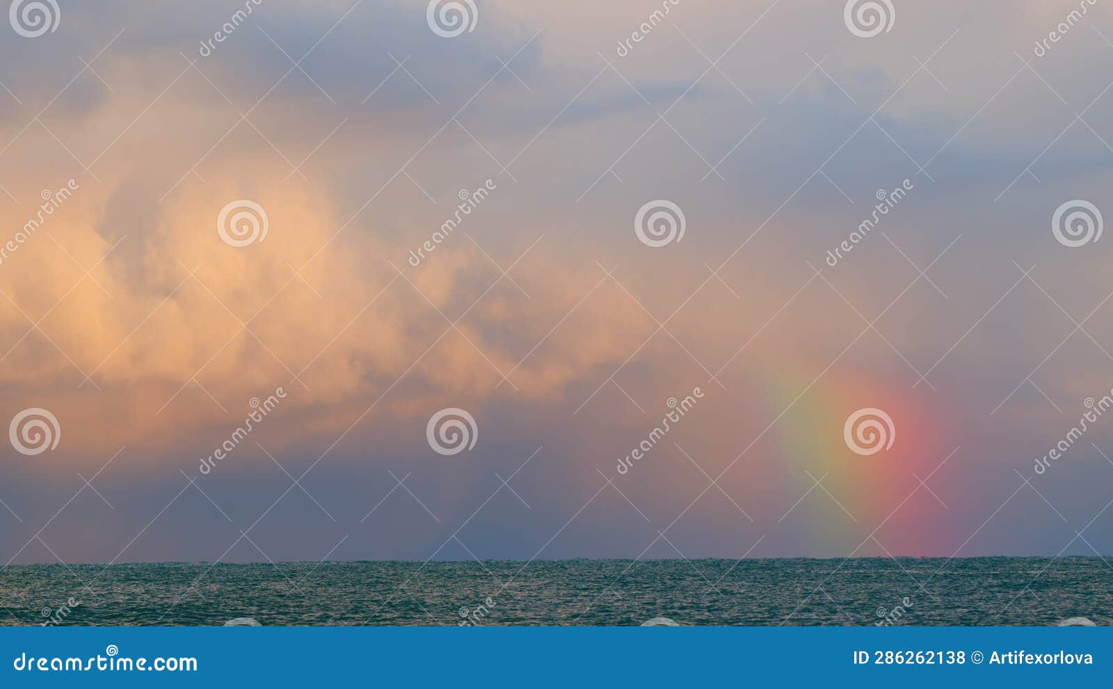 Arc of Rainbow with Sunset Orange Clouds Tropical Sky. Rain and ...