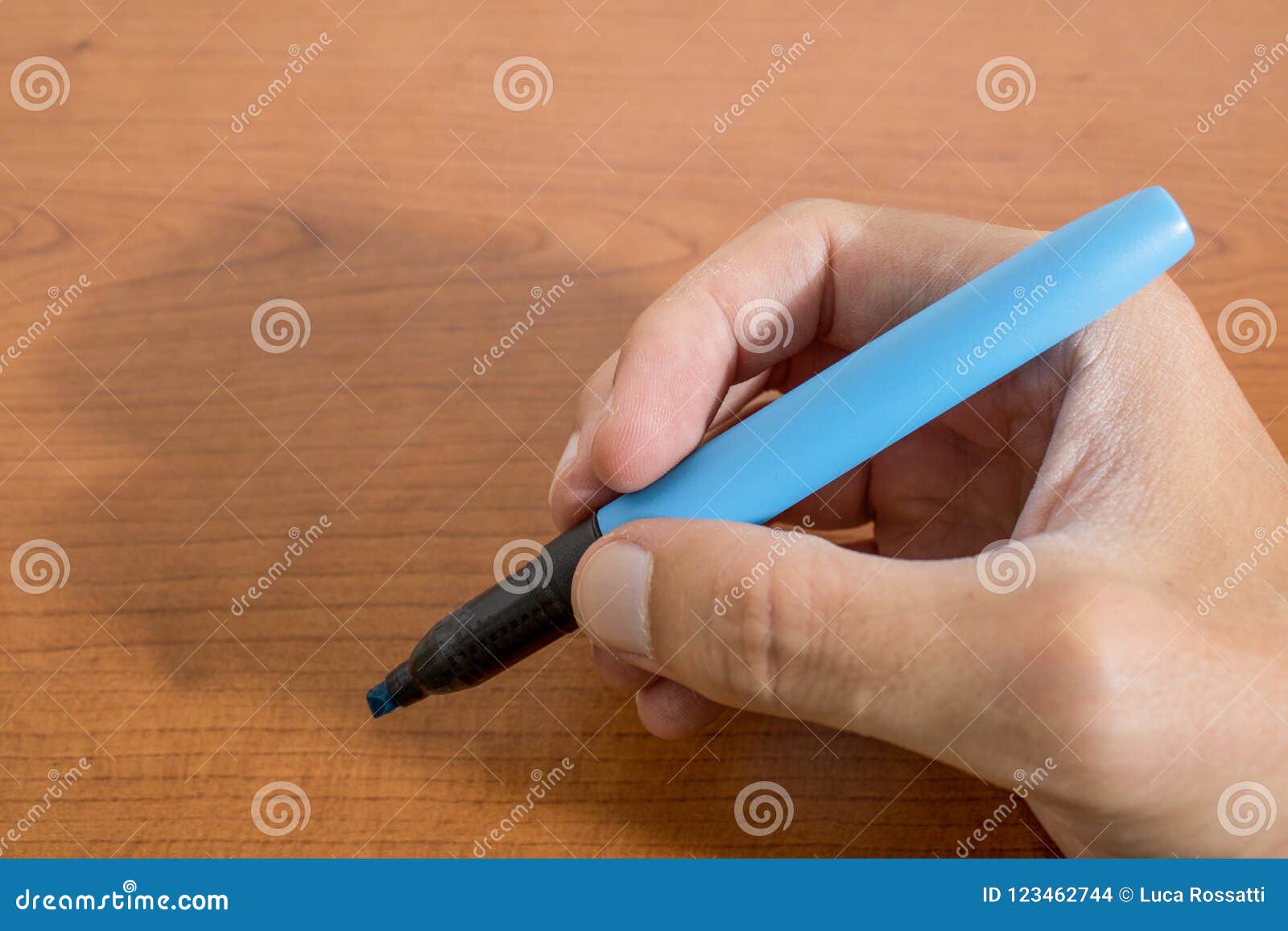 Stationery, a Hand is Holding a Blue Marker Stock Photo - Image of ...