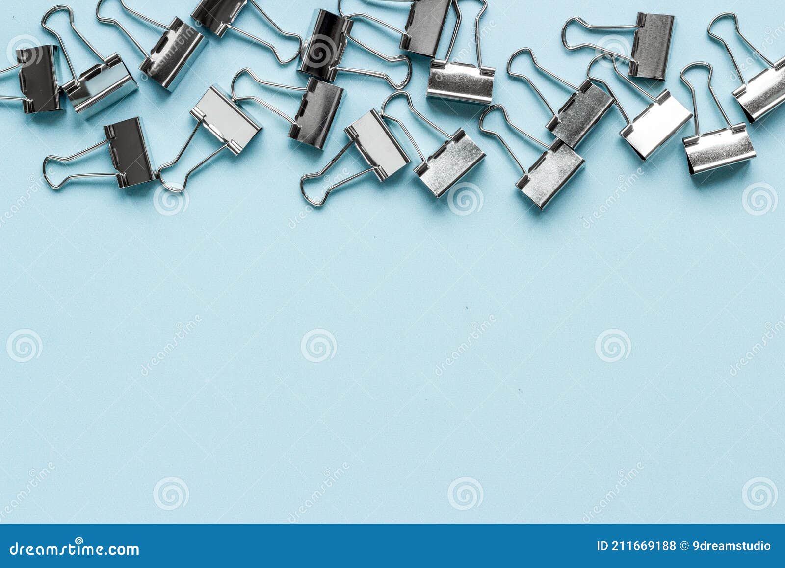 Stationery and Office Supplies Background. Paper Binder Clips Top View ...