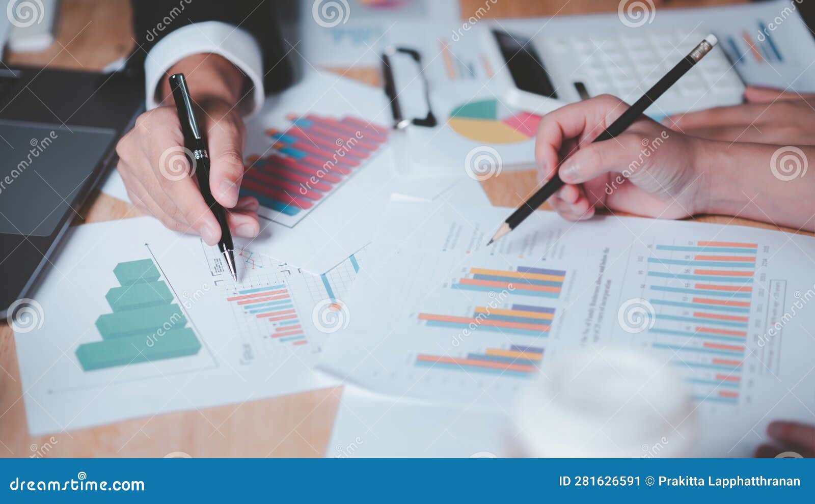 Statistical Analyst Reading Graph Report and Business Statistics Charts ...