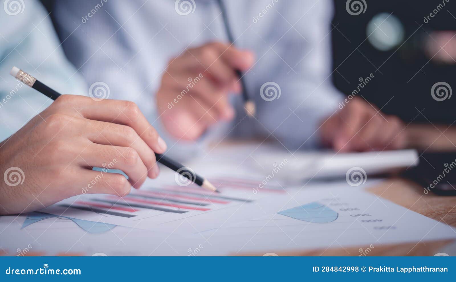 Statistical Analyst Reading Graph Report and Business Statistics Charts ...