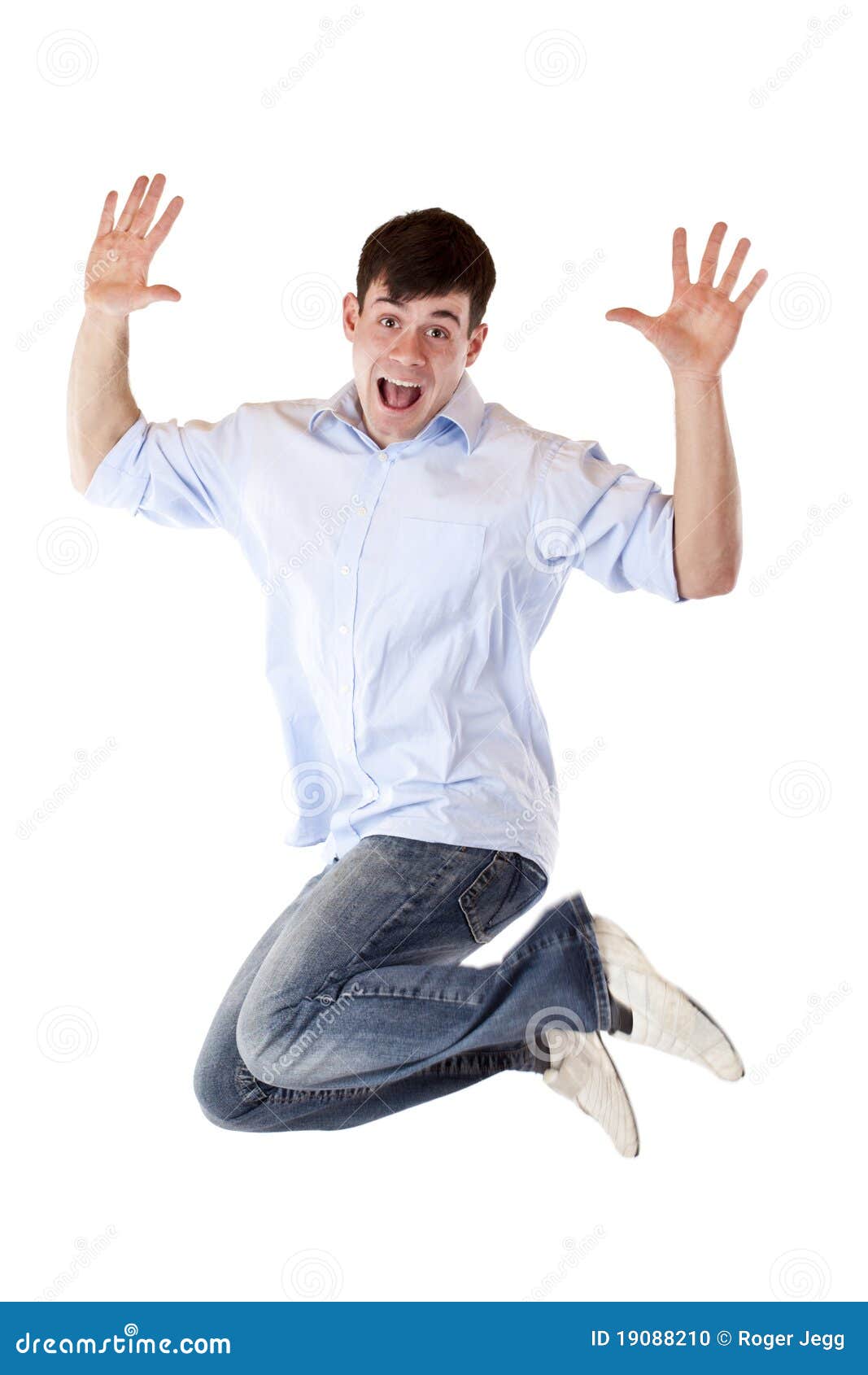 Stattlicher Junger Mann Springt in Die Luft Aus Freude Heraus Stockfoto ...