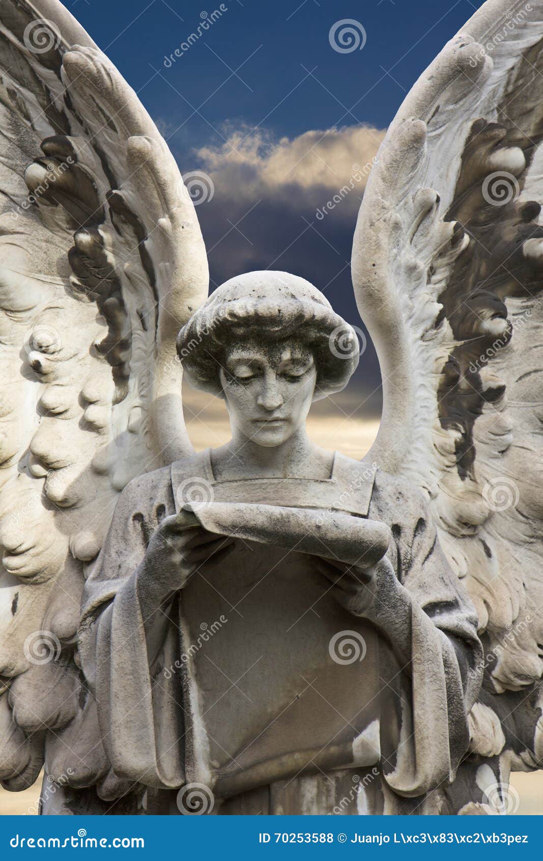 Statue of an Angel Reading a Scroll with Sunset Landscape Stock Photo ...