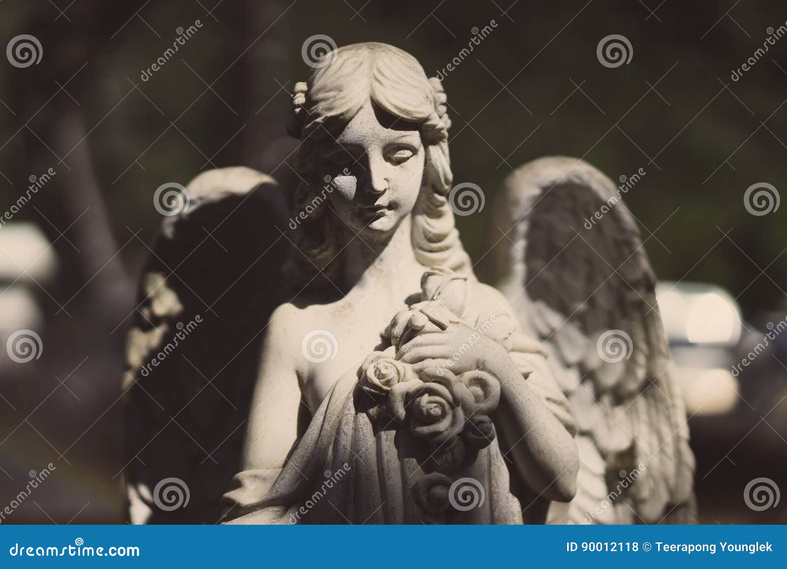 Statue of an Angel with Wings in the Sunshine. Stock Photo - Image of ...