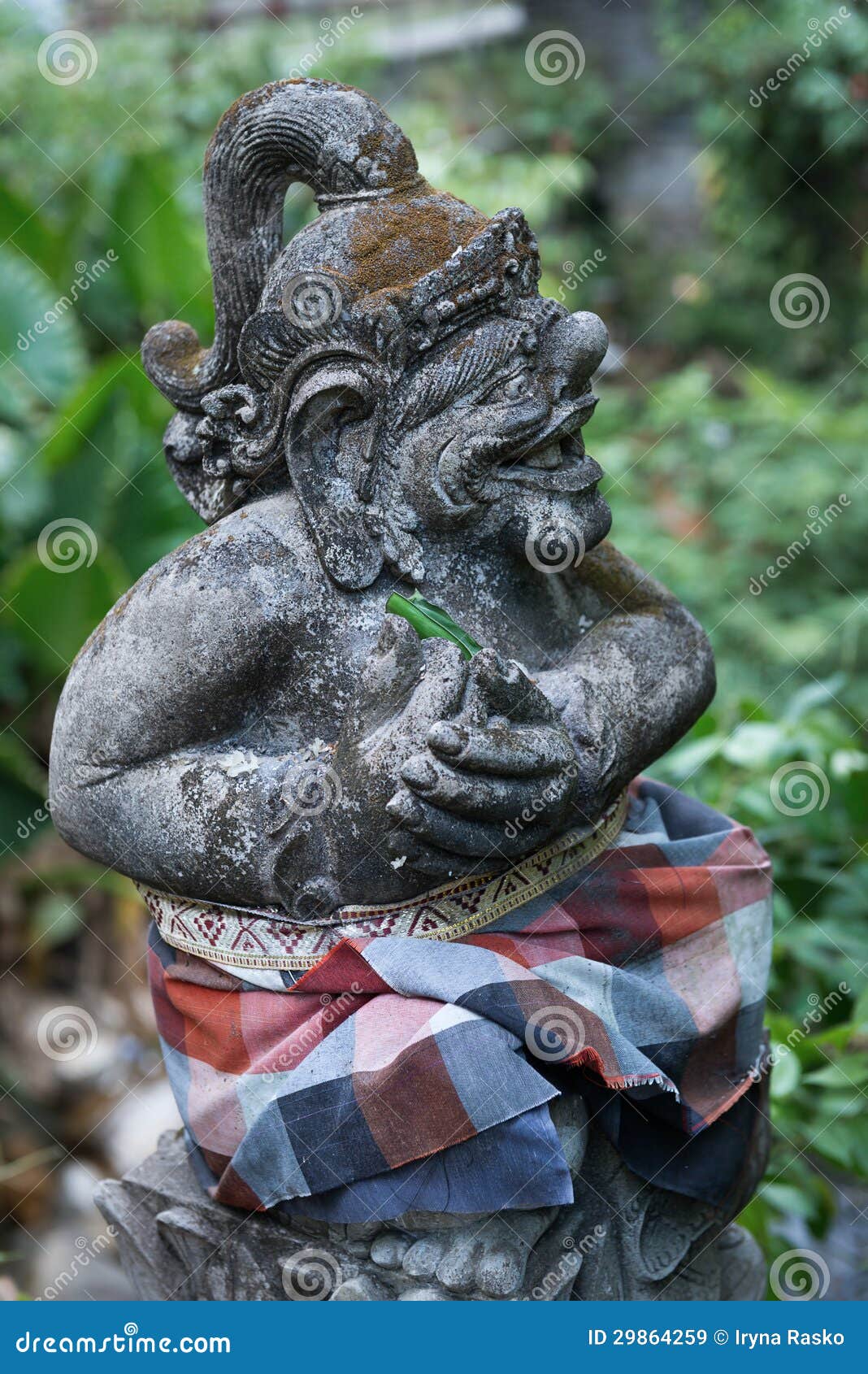 Balinese Demon Statue Dressed In A Sarong Stock Photo | CartoonDealer ...