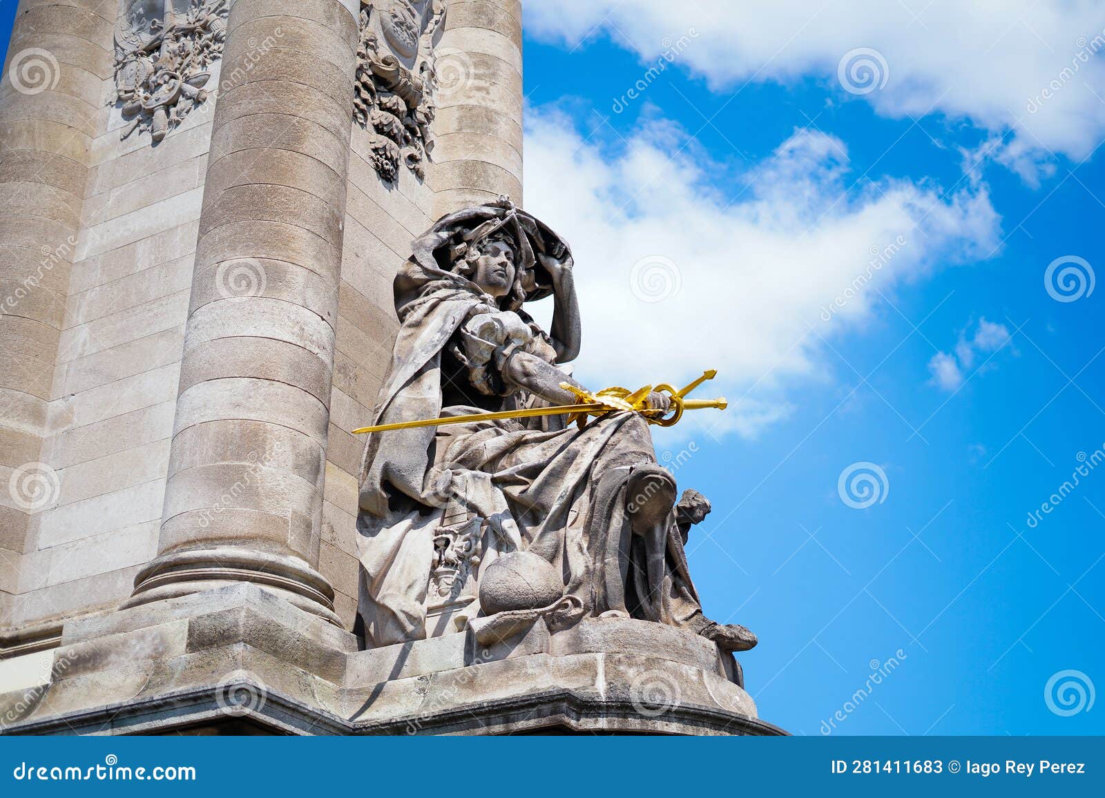Statue in a Column with a Gold Sword Stock Image - Image of legend ...