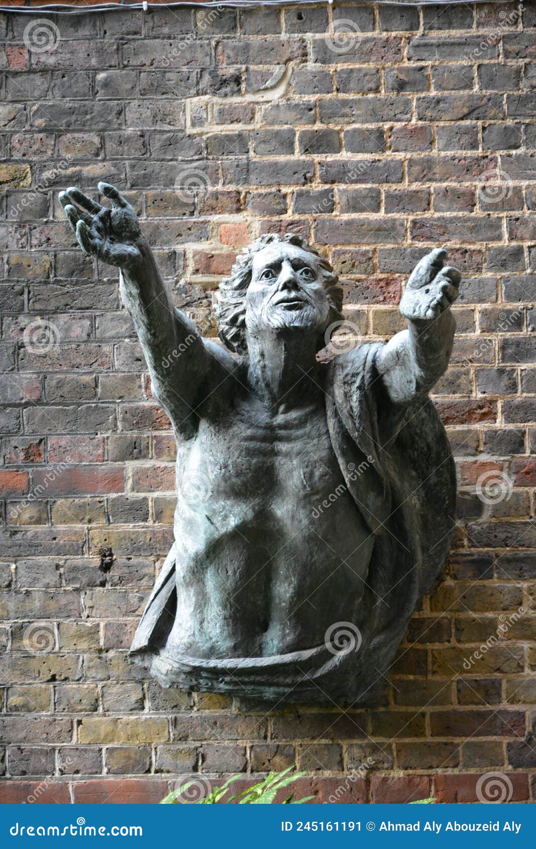 Statue Coming Out of a Wall Stock Image - Image of statue, rock: 245161191