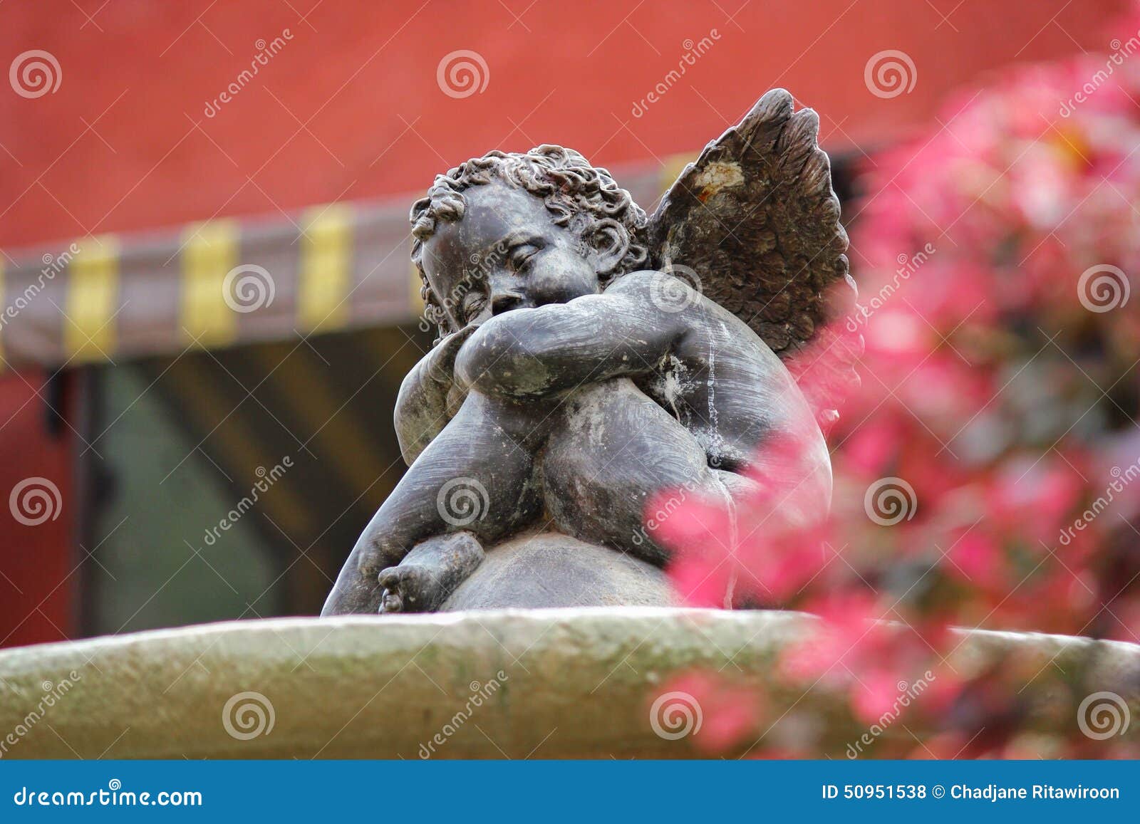 Statue of Cupid stock photo. Image of emotion, garden - 50951538