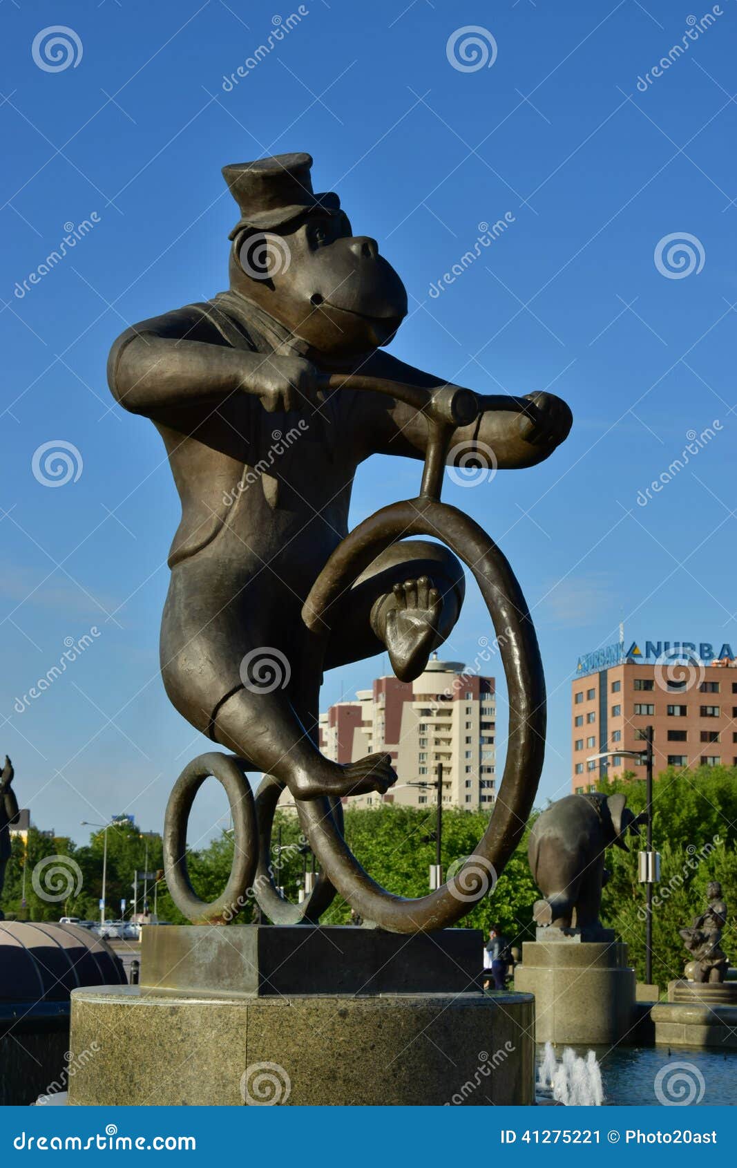 A Statue Featuring a Monkey Riding a Circus Bicycle Editorial Photo ...