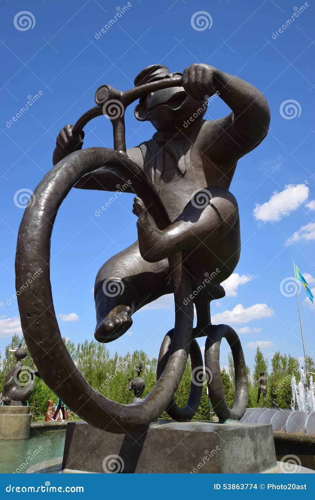A Statue Featuring a Monkey Riding a Circus Bicycle Editorial Stock ...