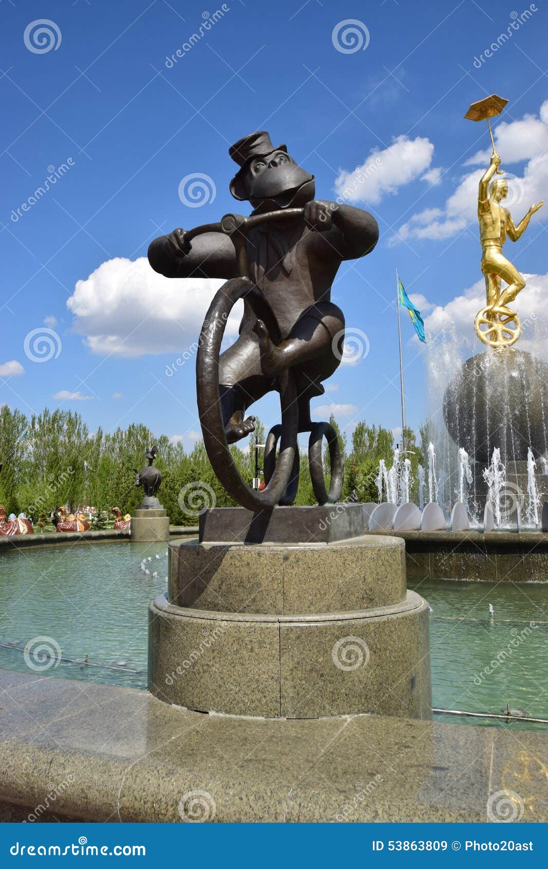 A Statue Featuring a Monkey Riding a Circus Bicycle Editorial Stock ...