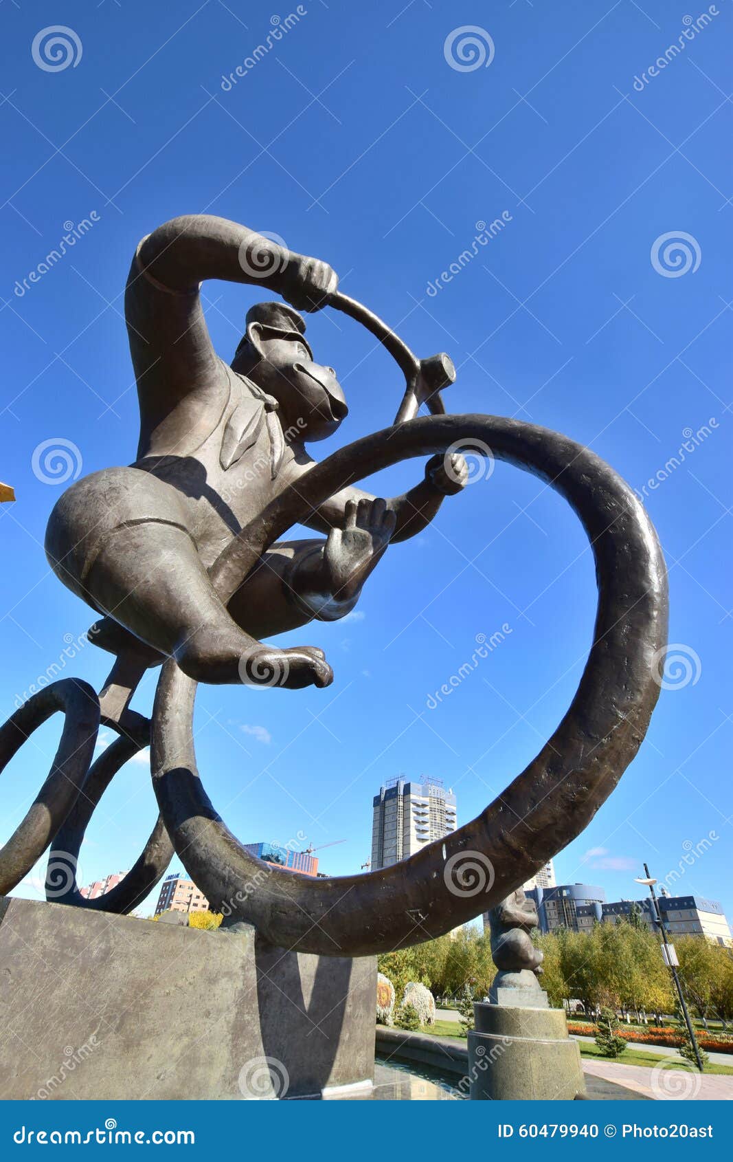 A Statue Featuring a Monkey Riding a Circus Bicycle Editorial Image ...