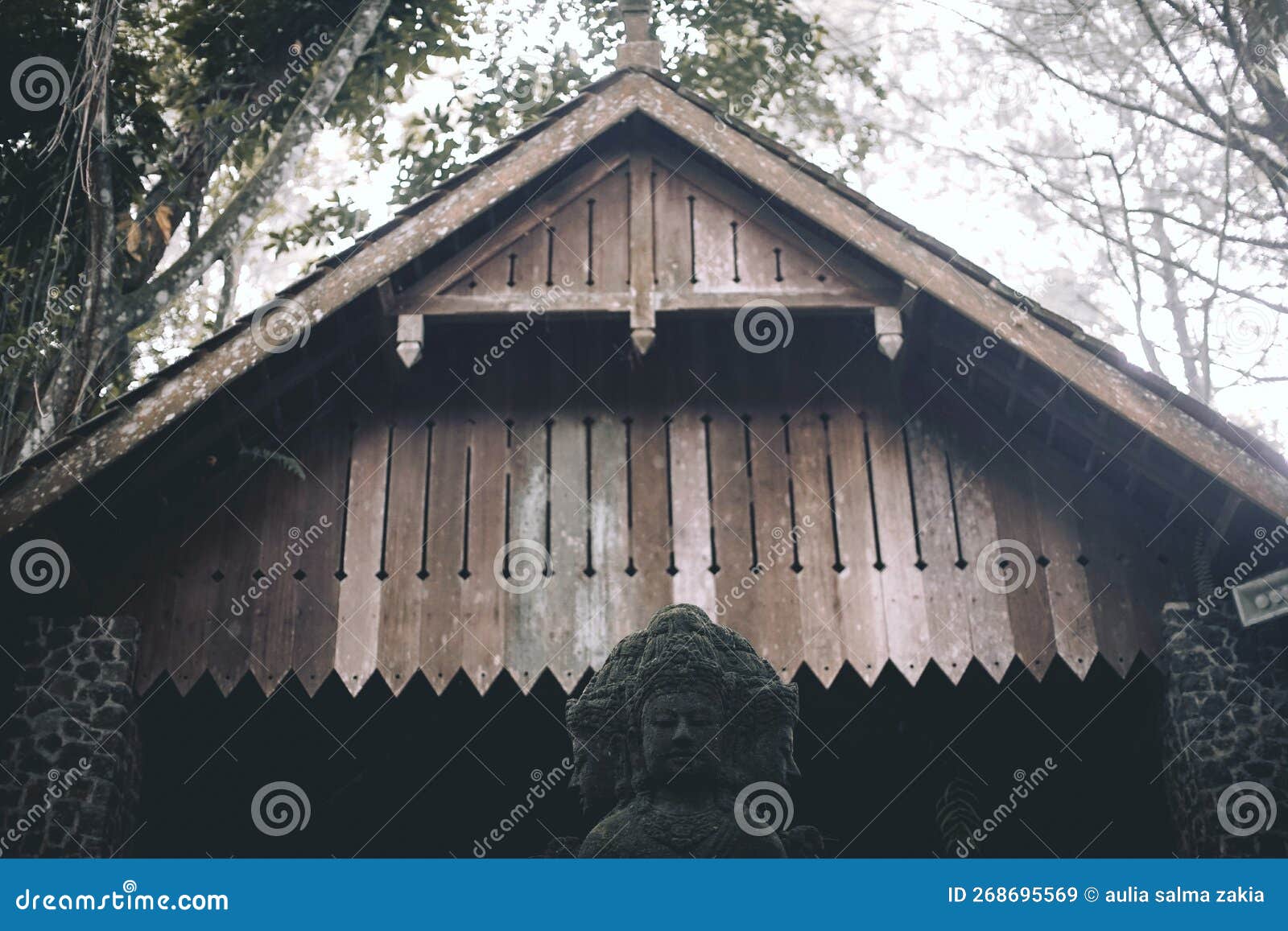 Statue stock image. Image of front, house, statue, dark - 268695569