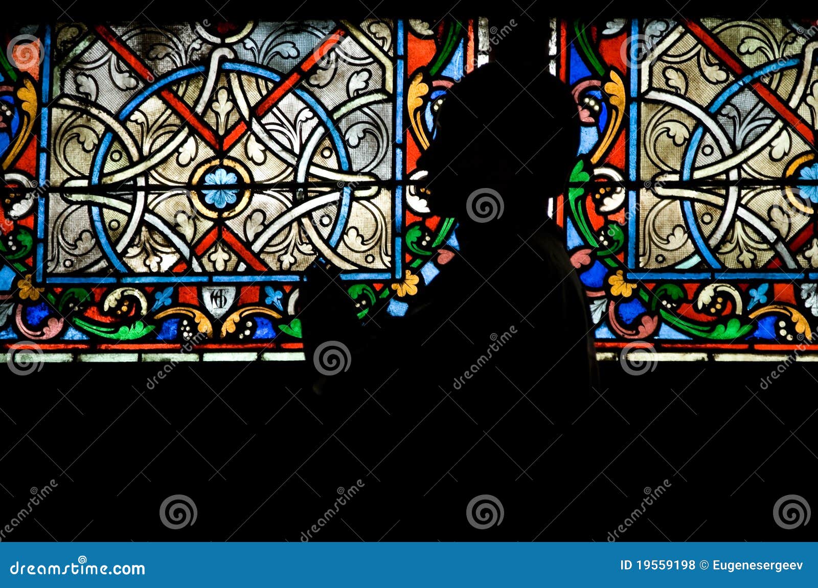 Statue in Front of Stained Glass Window Stock Photo - Image of ...