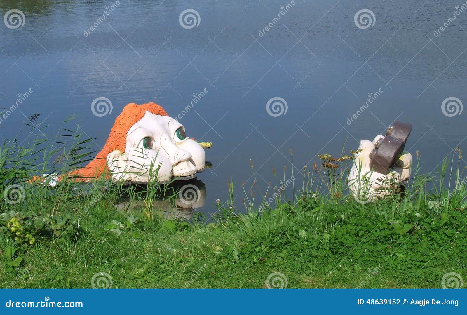 Statue of Girl Playing Game in Water Stock Photo - Image of girl, grass ...