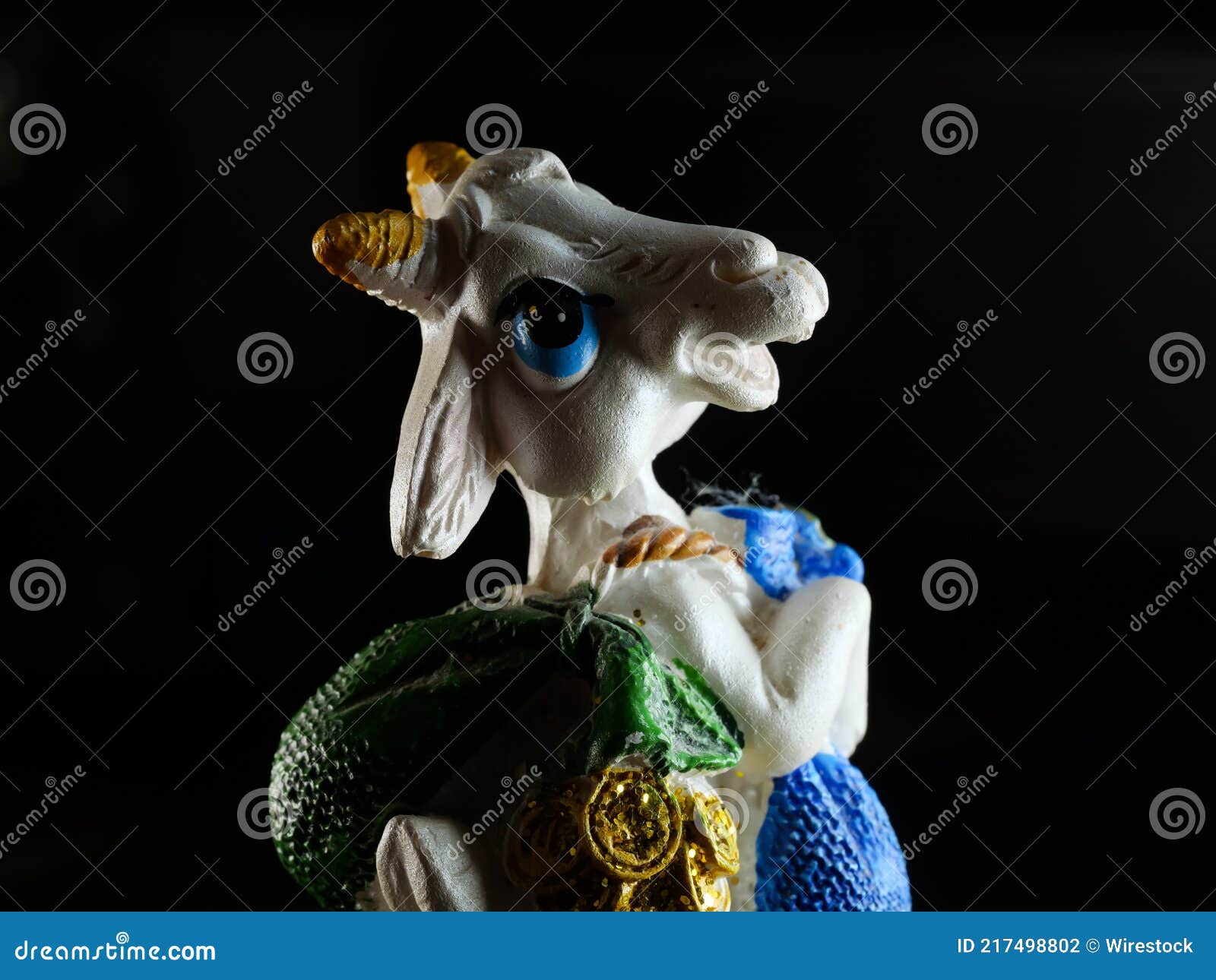 Statue of a Goat Carrying Gold Symbolizing Wealth Isolated on the Black ...