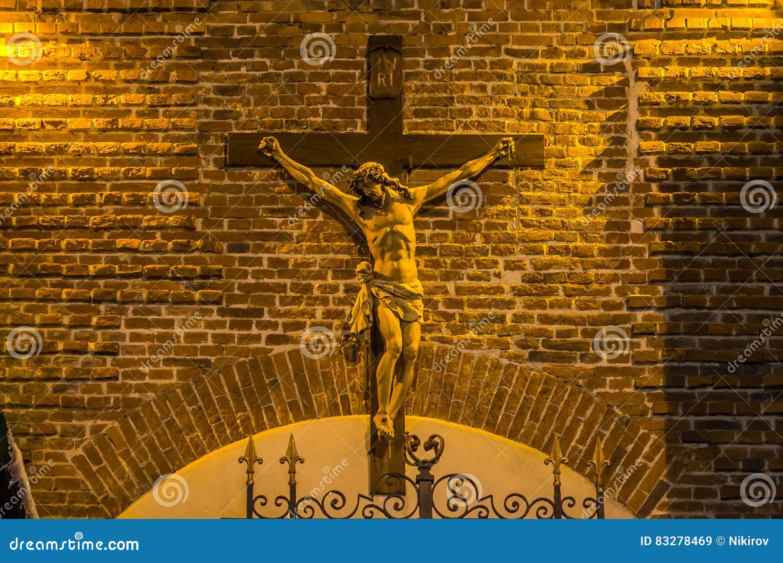 Statue of Jesus Christ Crucifixion on a Brick Wall Background Stock ...