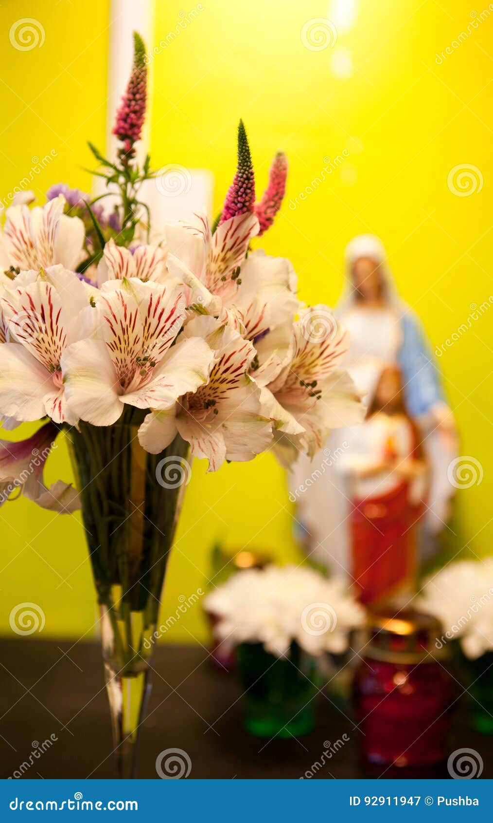 A Statue of Jesus and Flowers Stock Image - Image of catholic, cross ...