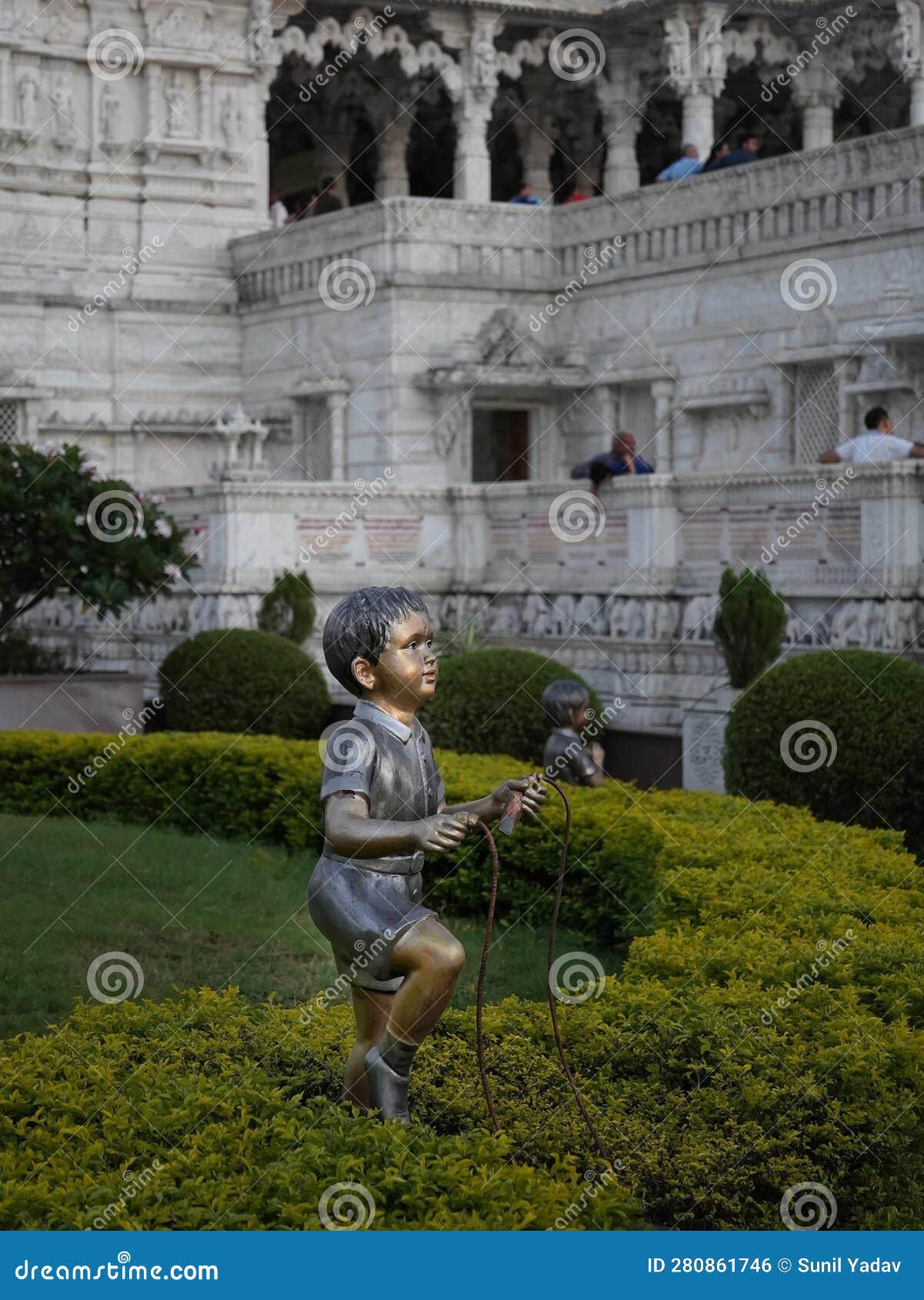 A Statue of a Kid in a Park Which is Representing Some Game Activities ...