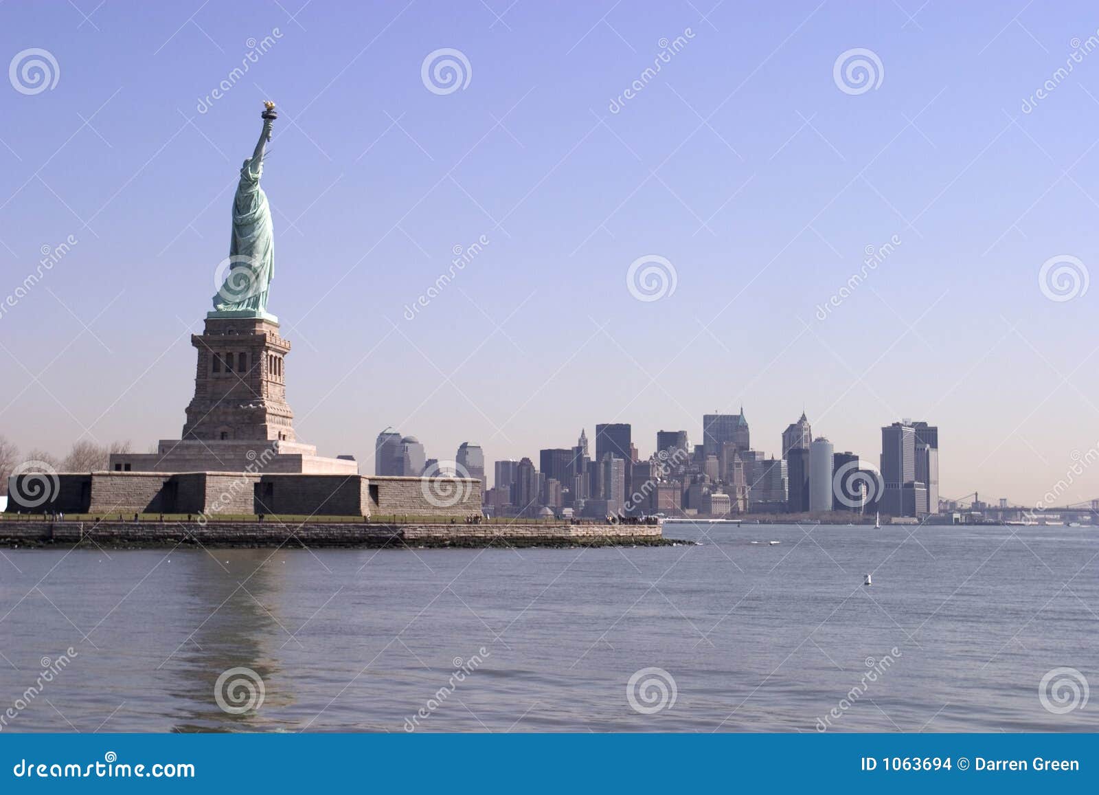 The Statue of Liberty and Lower Manhattan Skyline - New York Stock ...