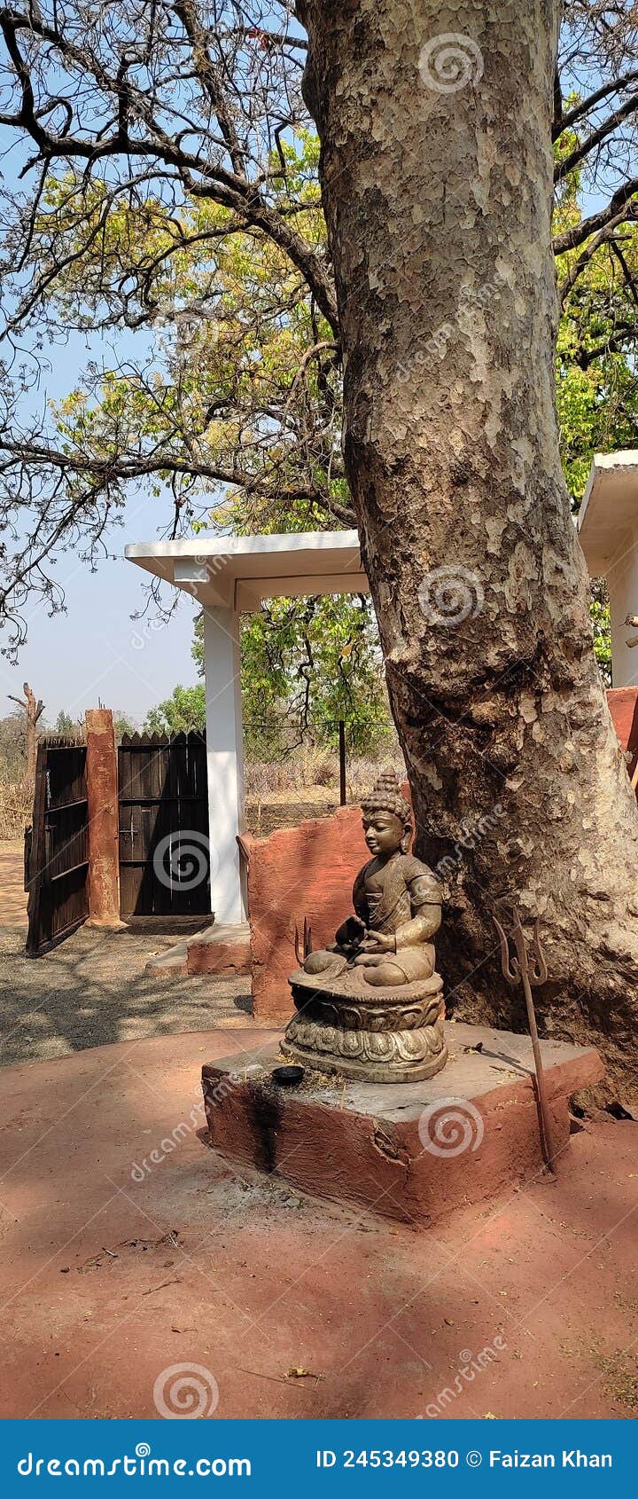 Statue of Lord Buddha Under a Tree Stock Photo - Image of flower, wood ...