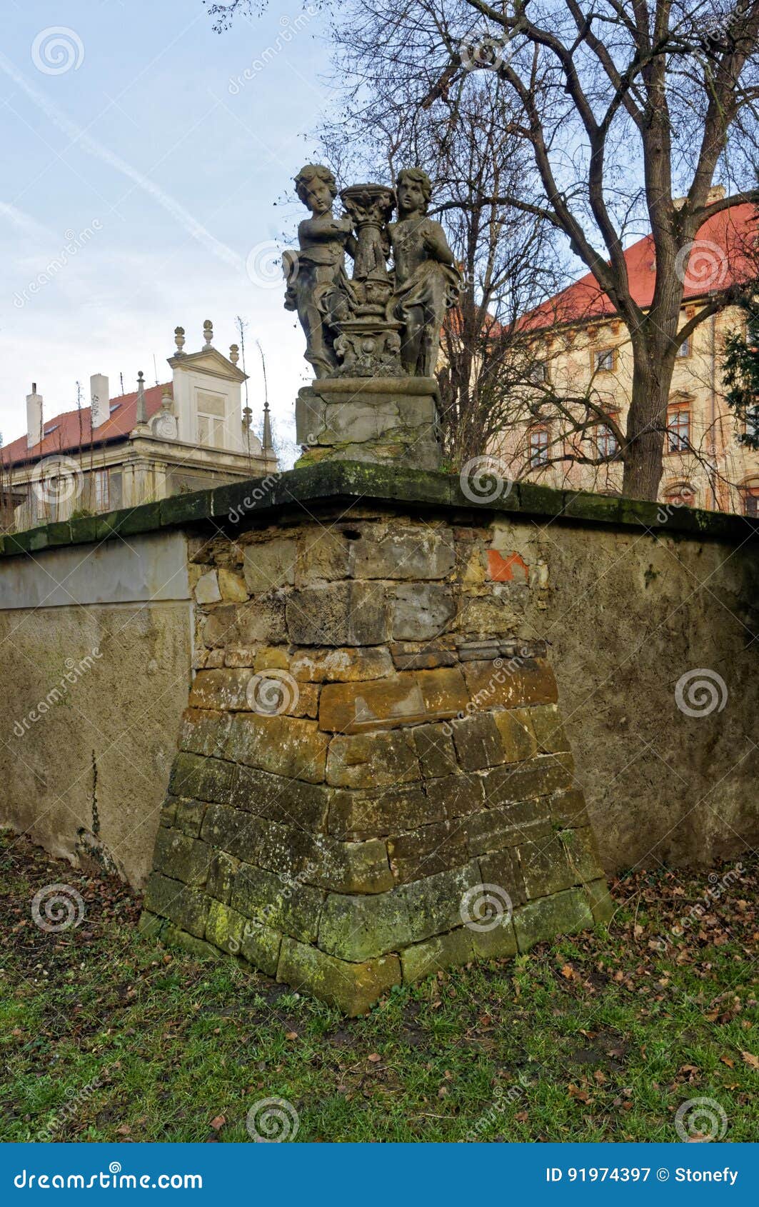 Statue of men on the wall stock image. Image of path - 91974397