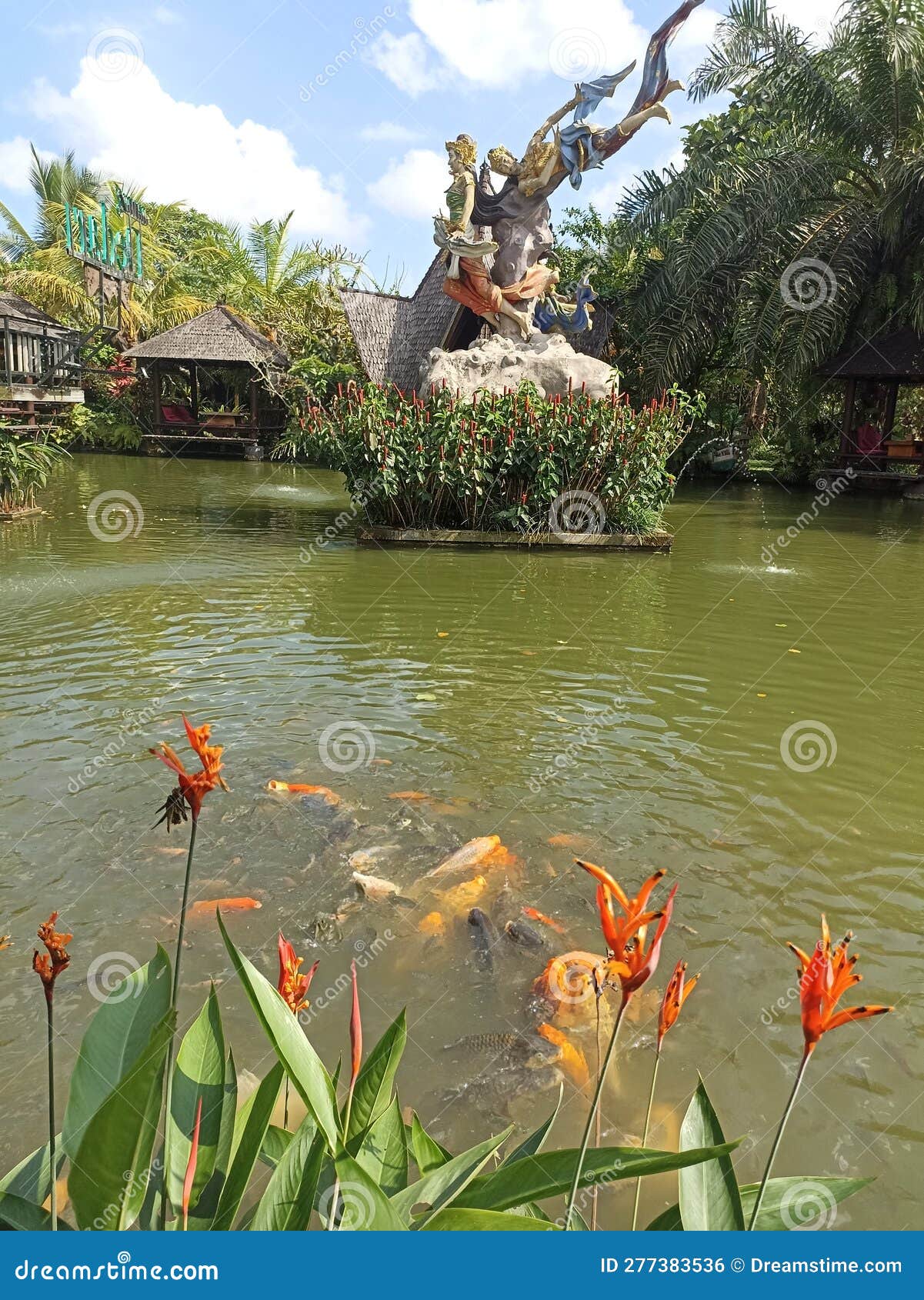 Statue in the Middle of a Fish Pond Stock Photo - Image of statue ...