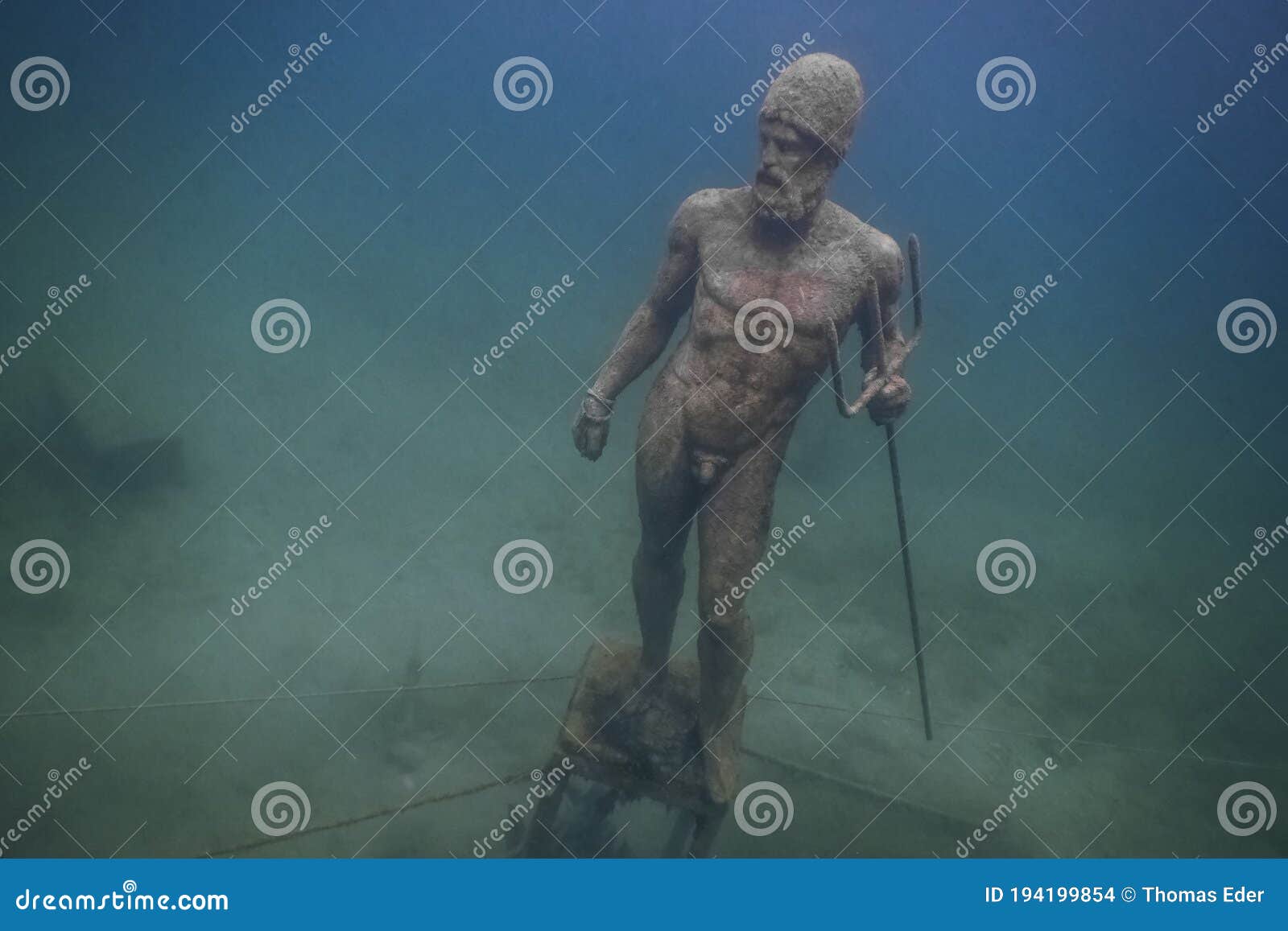 Statue Poseidon with a Trident at the Ground from a Lake while Diving ...
