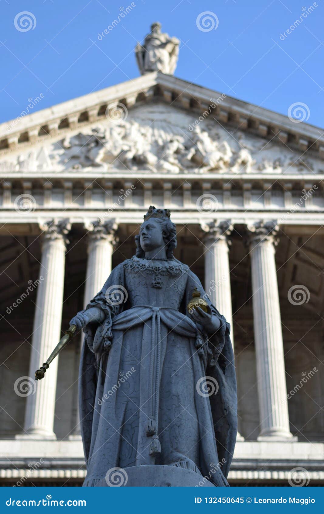 Statue of a Queen with the Fronton of a Cathedral in the Background in ...