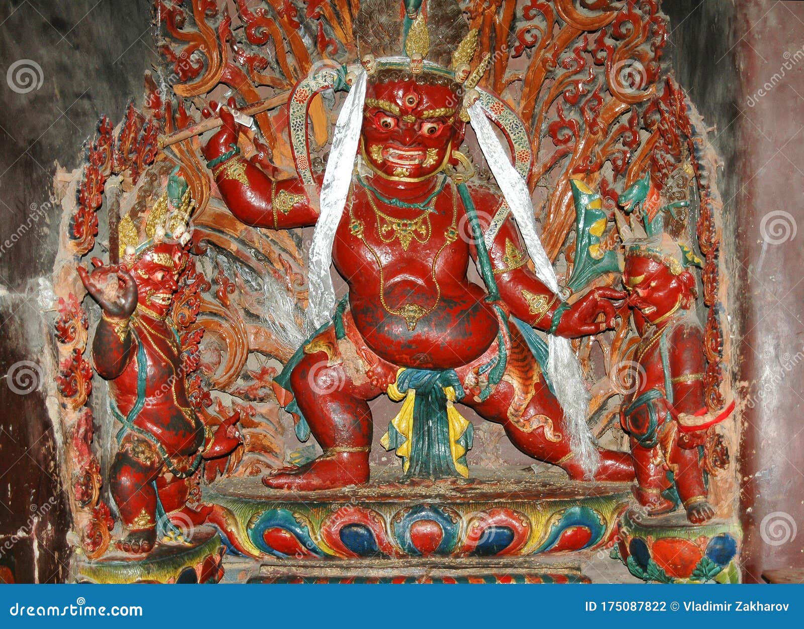 Statue of a Red Tibetan Deity in a Monastery Stock Photo - Image of ...
