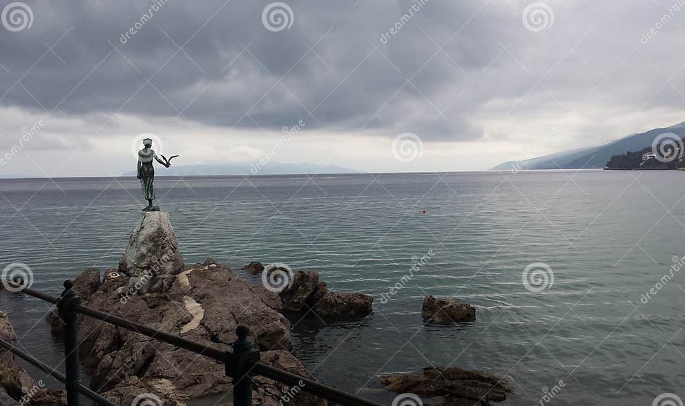 Statue on the rock stock photo. Image of statue, clouds - 55462148