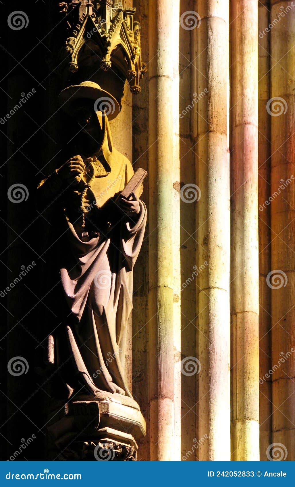 Statue of a Saint in Light and Shadow Stock Image - Image of graceful ...