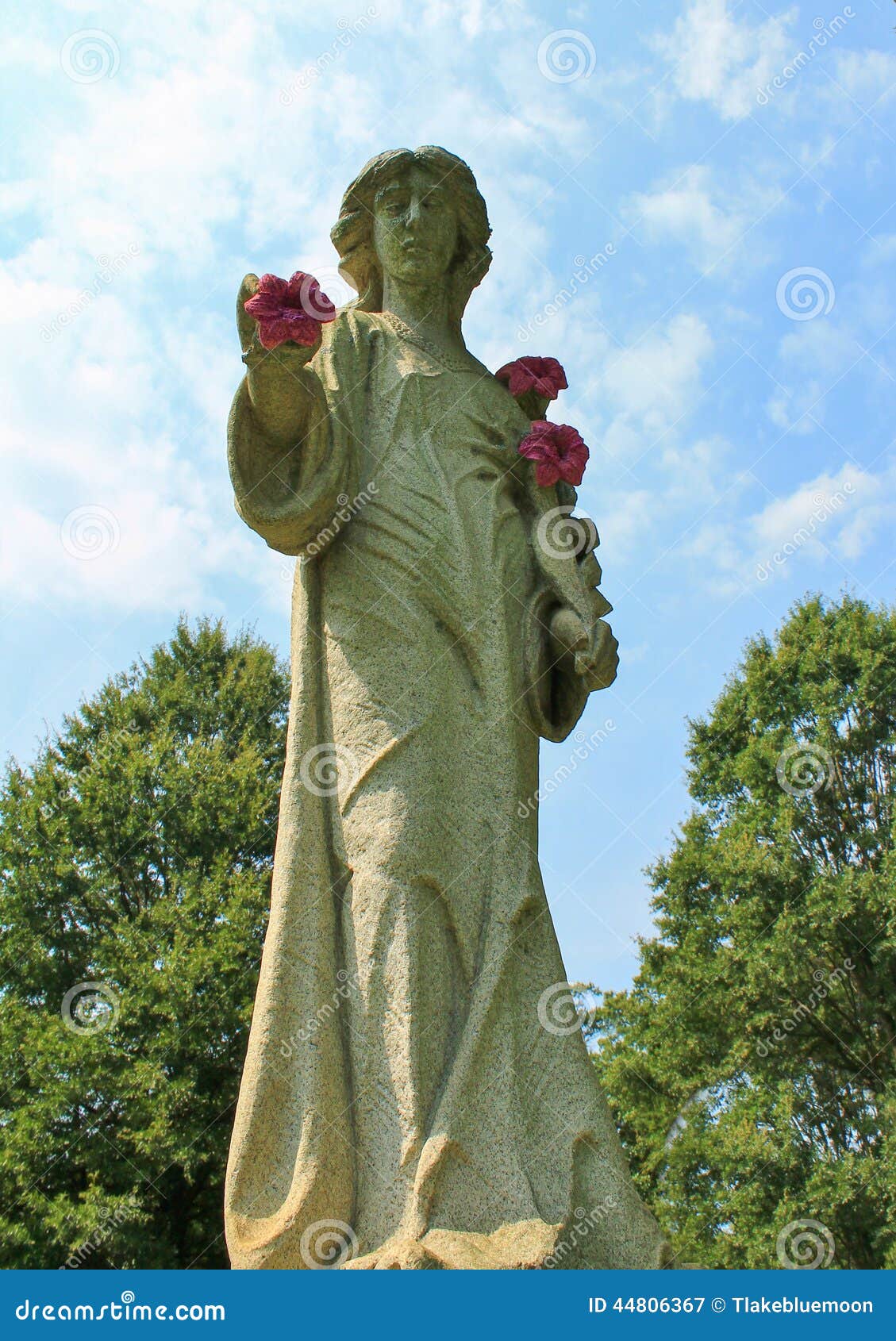 Statue of a Woman with Flowers Stock Image - Image of statue, love ...