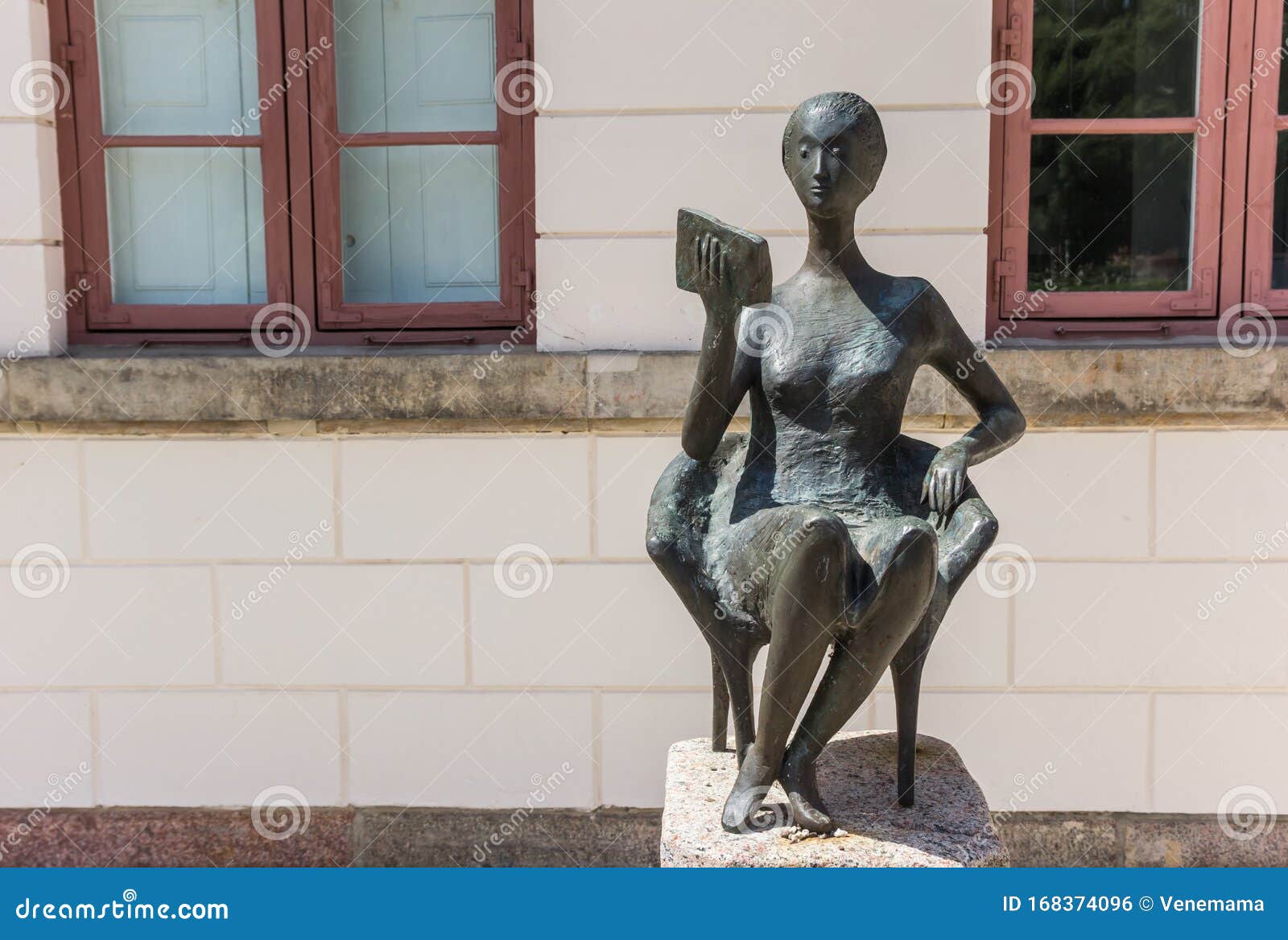 Statue of a Woman Reading in Front of the Library in Eutin Editorial ...