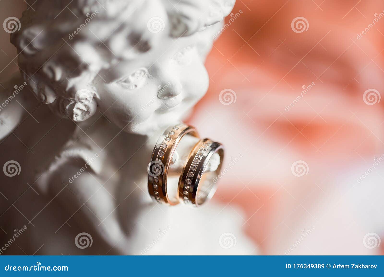 Statuette of an Angel with Wedding Golden Rings. Stock Image - Image of ...