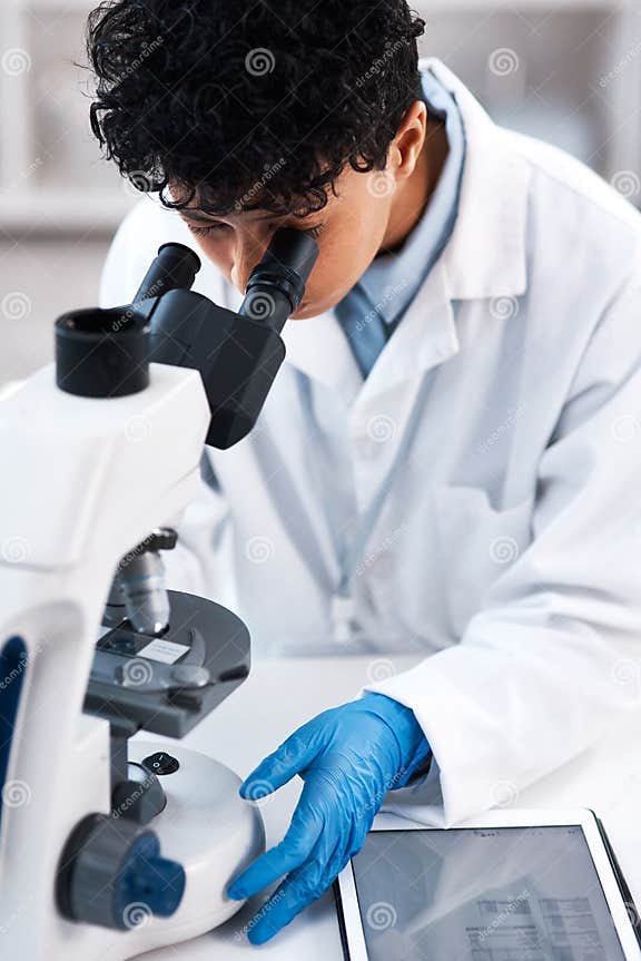 Stay Curious about the World. a Young Scientist Using a Microscope in a ...