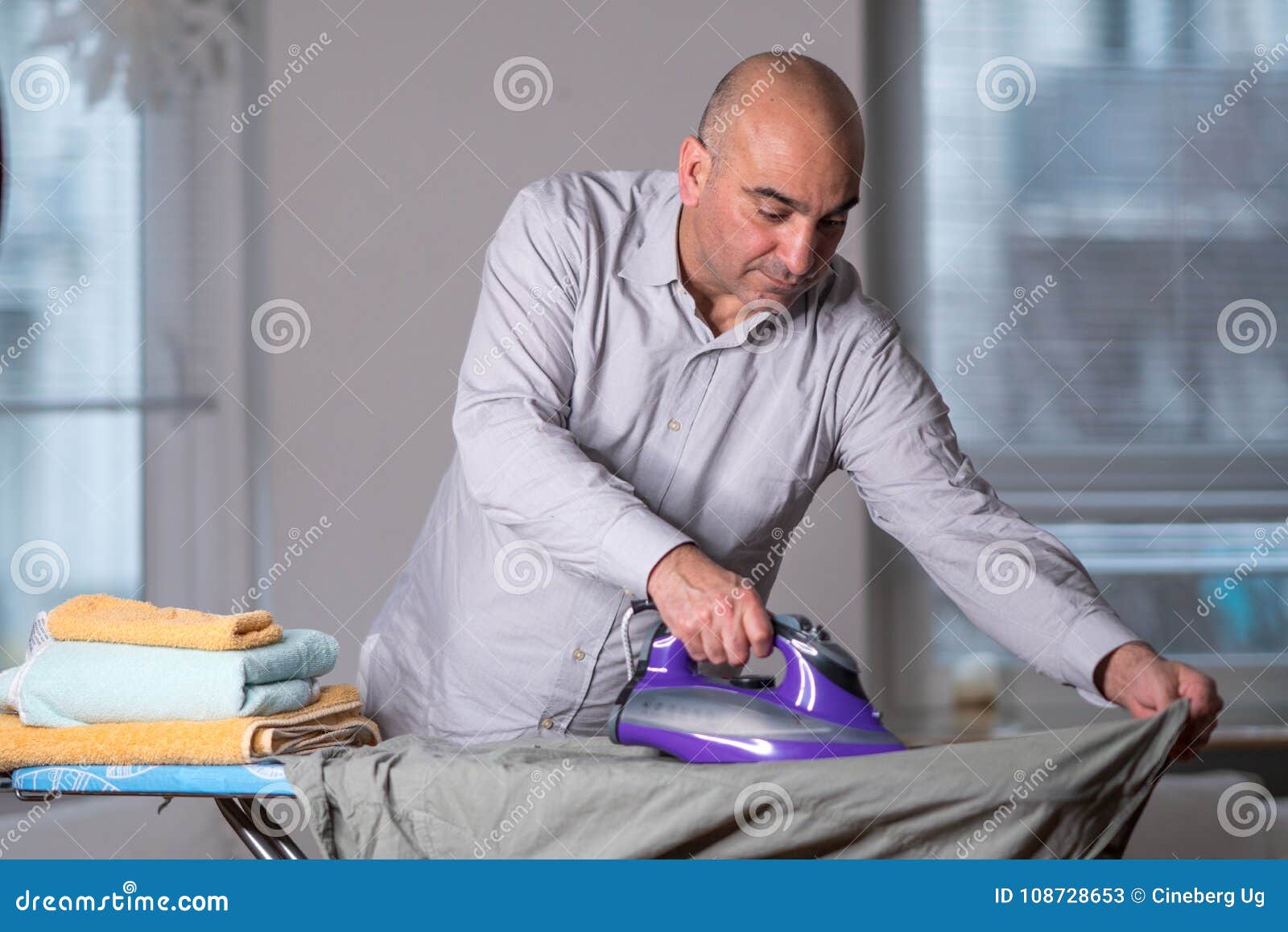 Stay-at-home dad ironing stock image. Image of laundry - 108728653