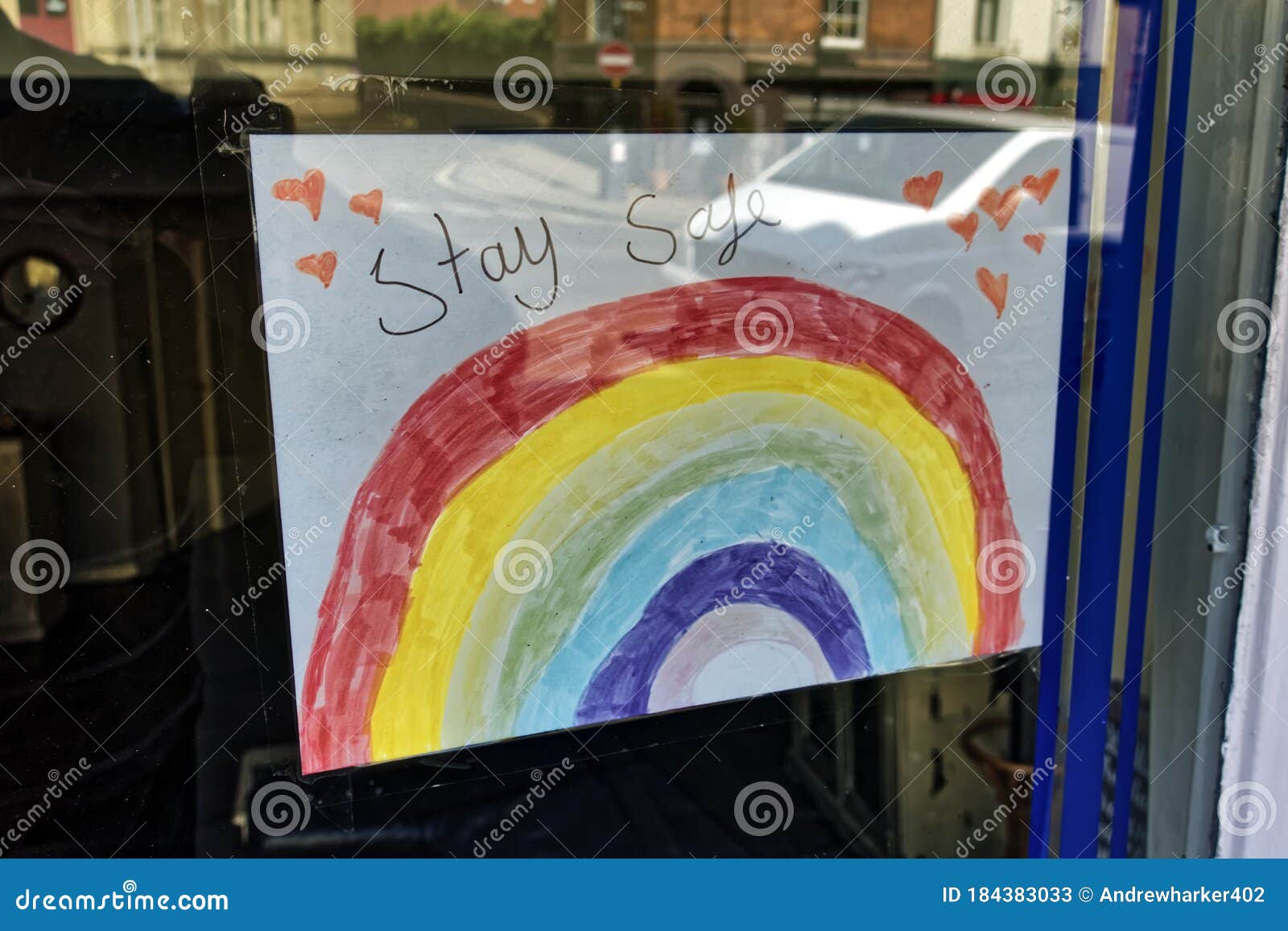 A Stay Safe from Coronavirus Rainbow Picture in a Shop Window Editorial ...